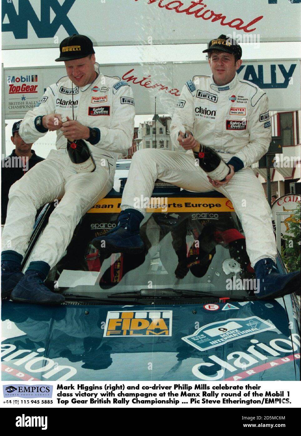 Mark Higgins (right) and co-driver Philip Mills celebrate their class ...