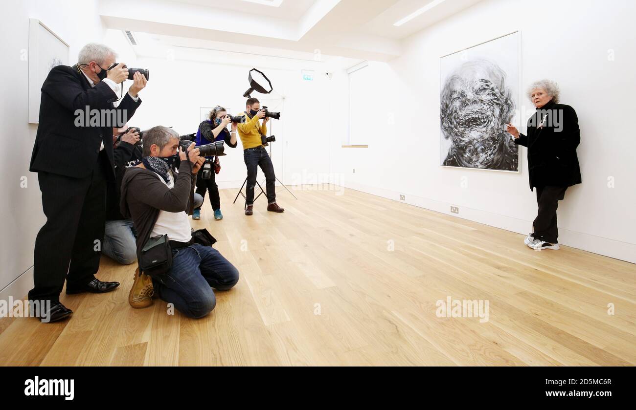 British artist Maggi Hambling is photographed standing next to her work ...