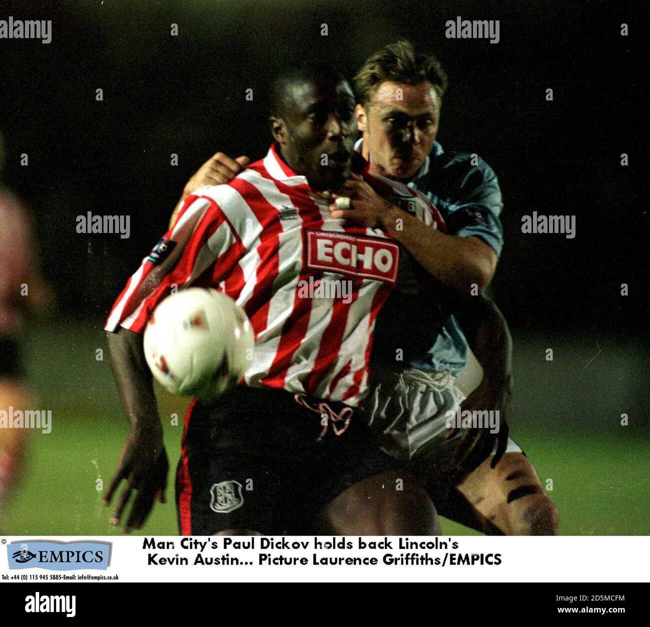 Manchester City's Paul Dickov holds back Lincoln's Terry Flemming Stock ...