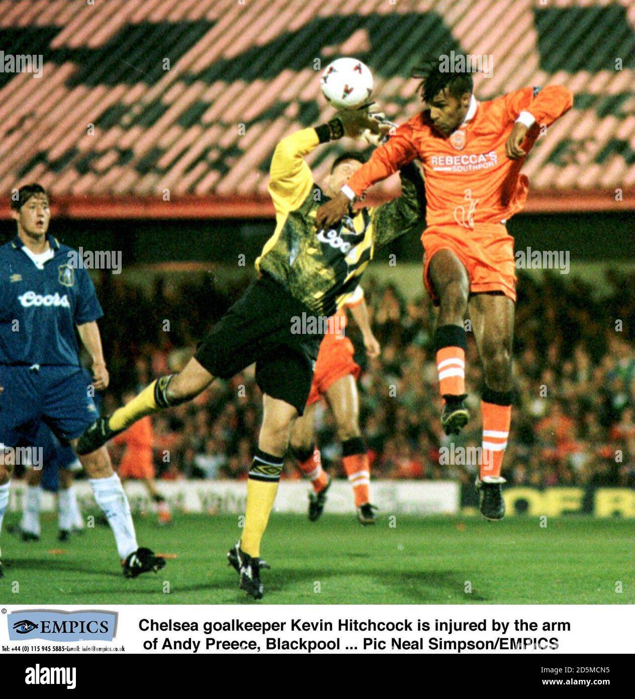 Chelsea goalkeeper Kevin Hitchcock is injured by the arm of Andy Preece ...