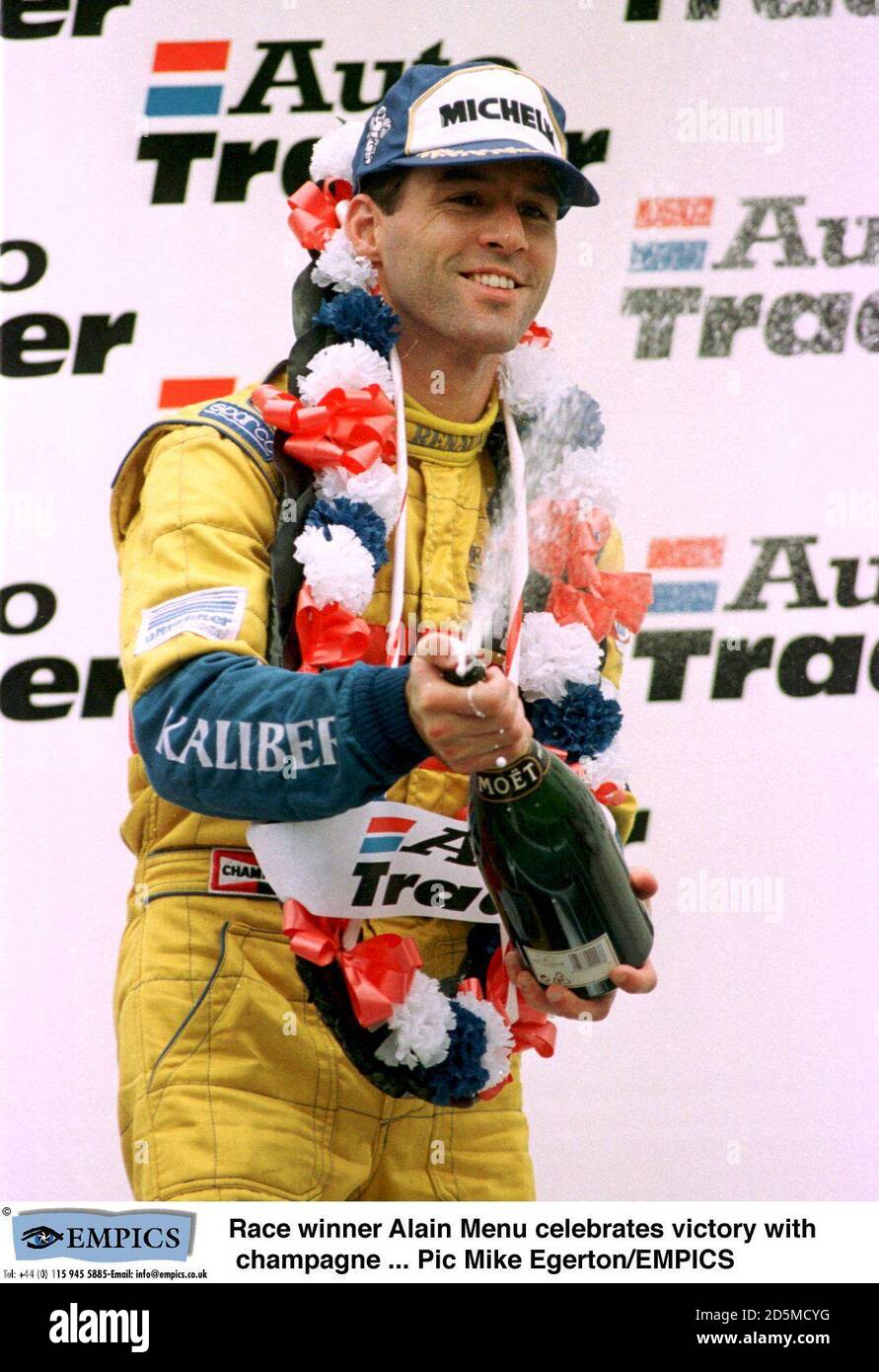Race winner Alain Menu celebrates victory with champagne Stock Photo ...