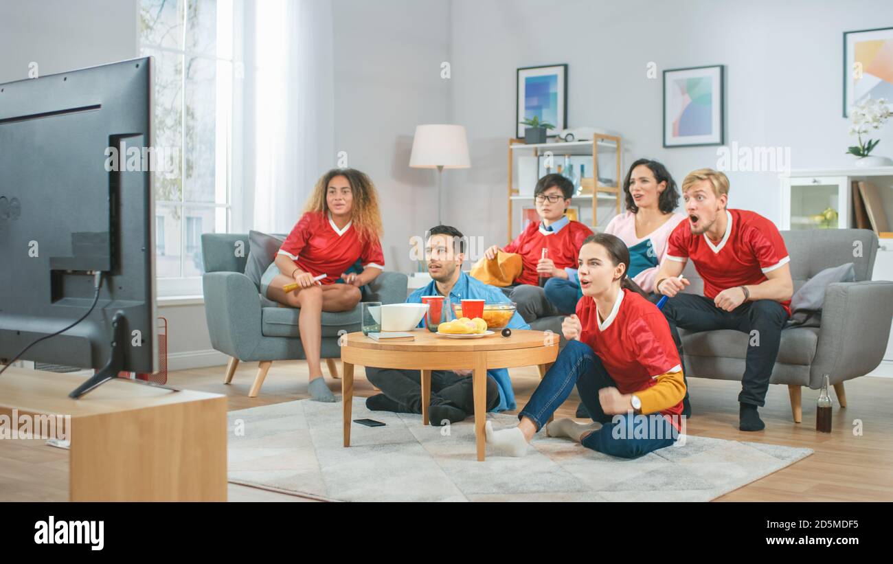 At Home Diverse Group of Sports Fans Wearing Team's Uniform Watch ...