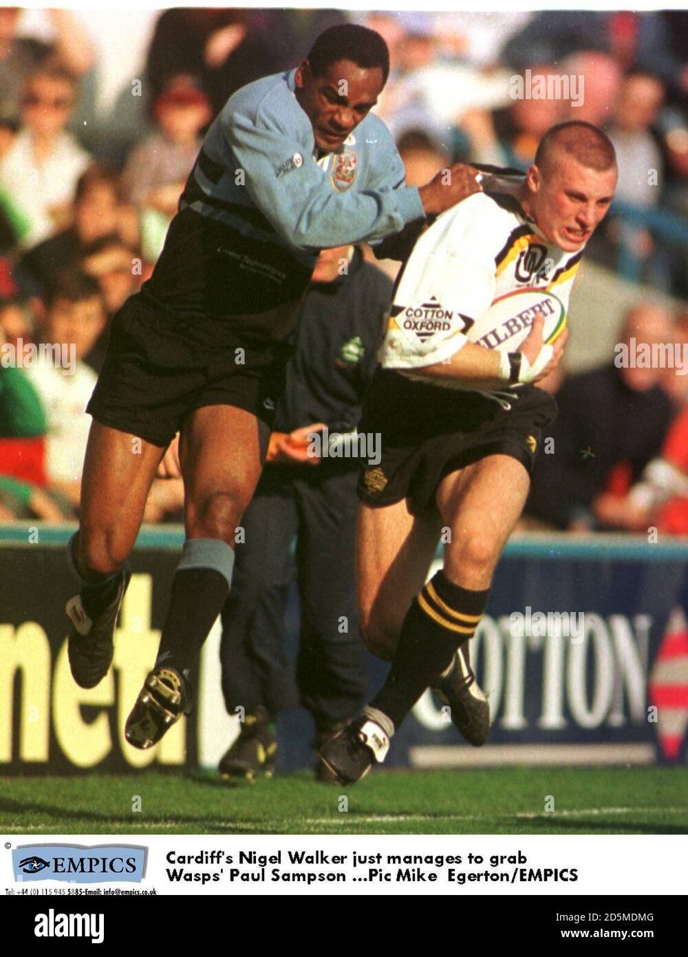 Cardiff's Nigel Walker just manages to grab Wasps' Paul Sampson Stock ...