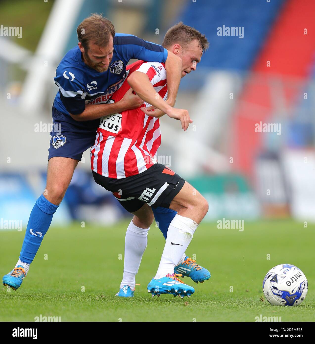 Oldham Athletic's James Dayton, left, and Melbourne City's Chris ...