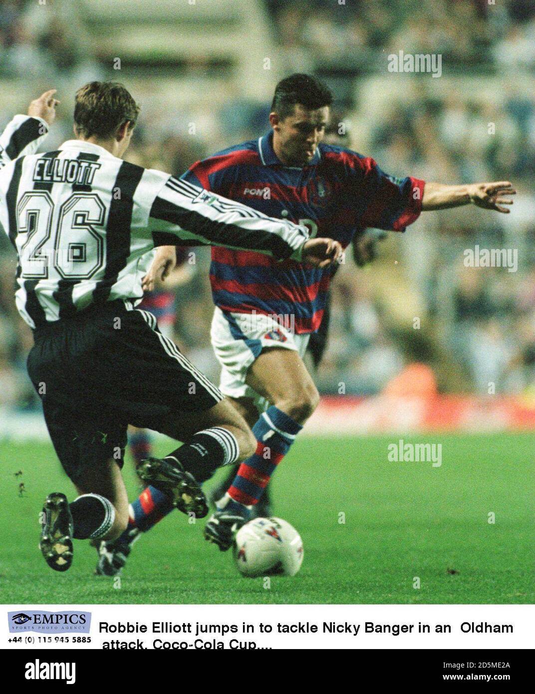 Robbie Elliott jumps in to tackle Nicky Banger in an Oldham attack ...