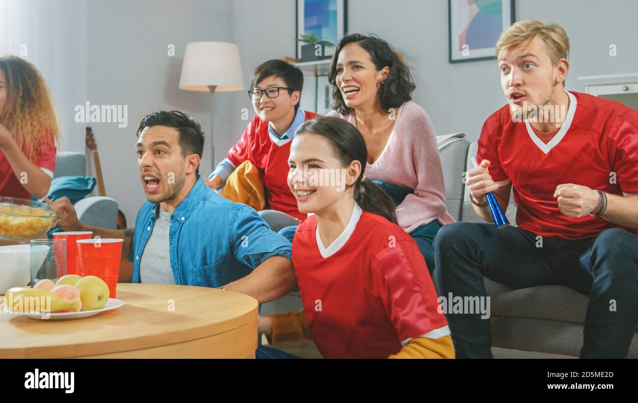 At Home Diverse Group of Sports Fans Wearing Team's Uniform Watch ...