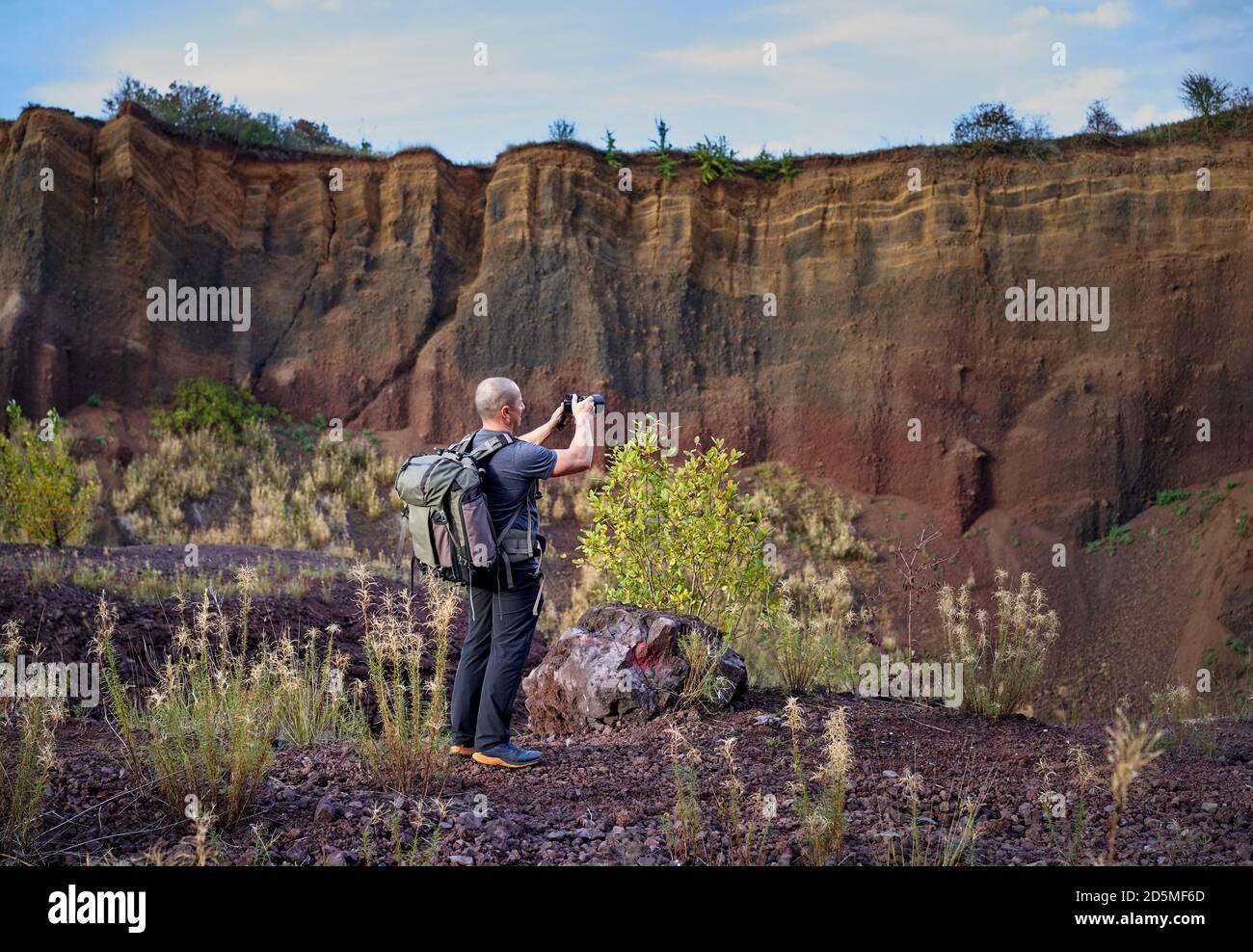 Professional photographer shooting inside the calder of an extinct ...