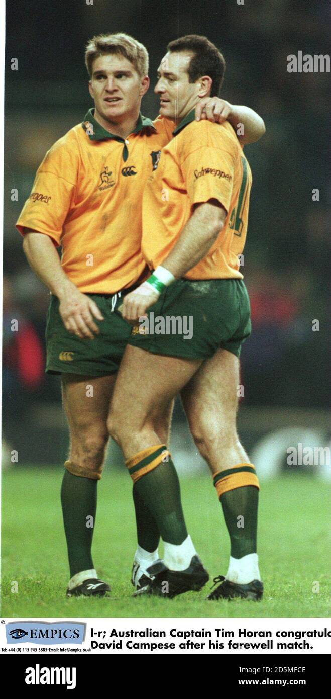 l-r; Australian Captain Tim Horan congratulatesrDavid Campese after his ...