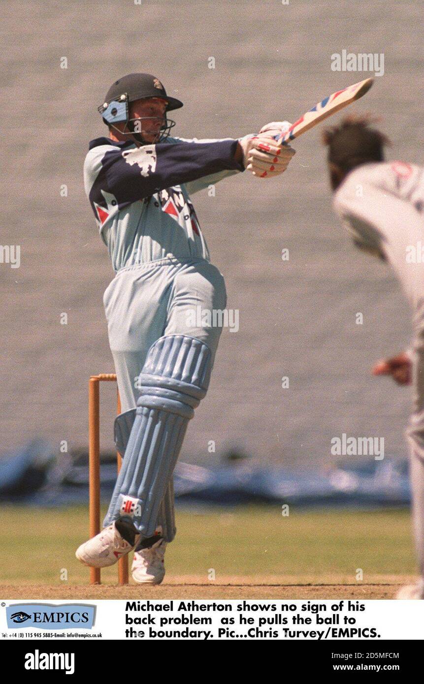 Michael Atherton shows no sign of his back problem as he pulls the ball ...