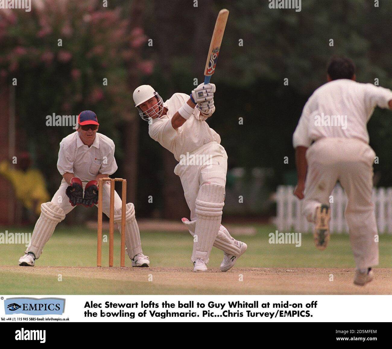 Alec Stewart lofts the ball to Guy Whitall at mid-on off the bowling of ...