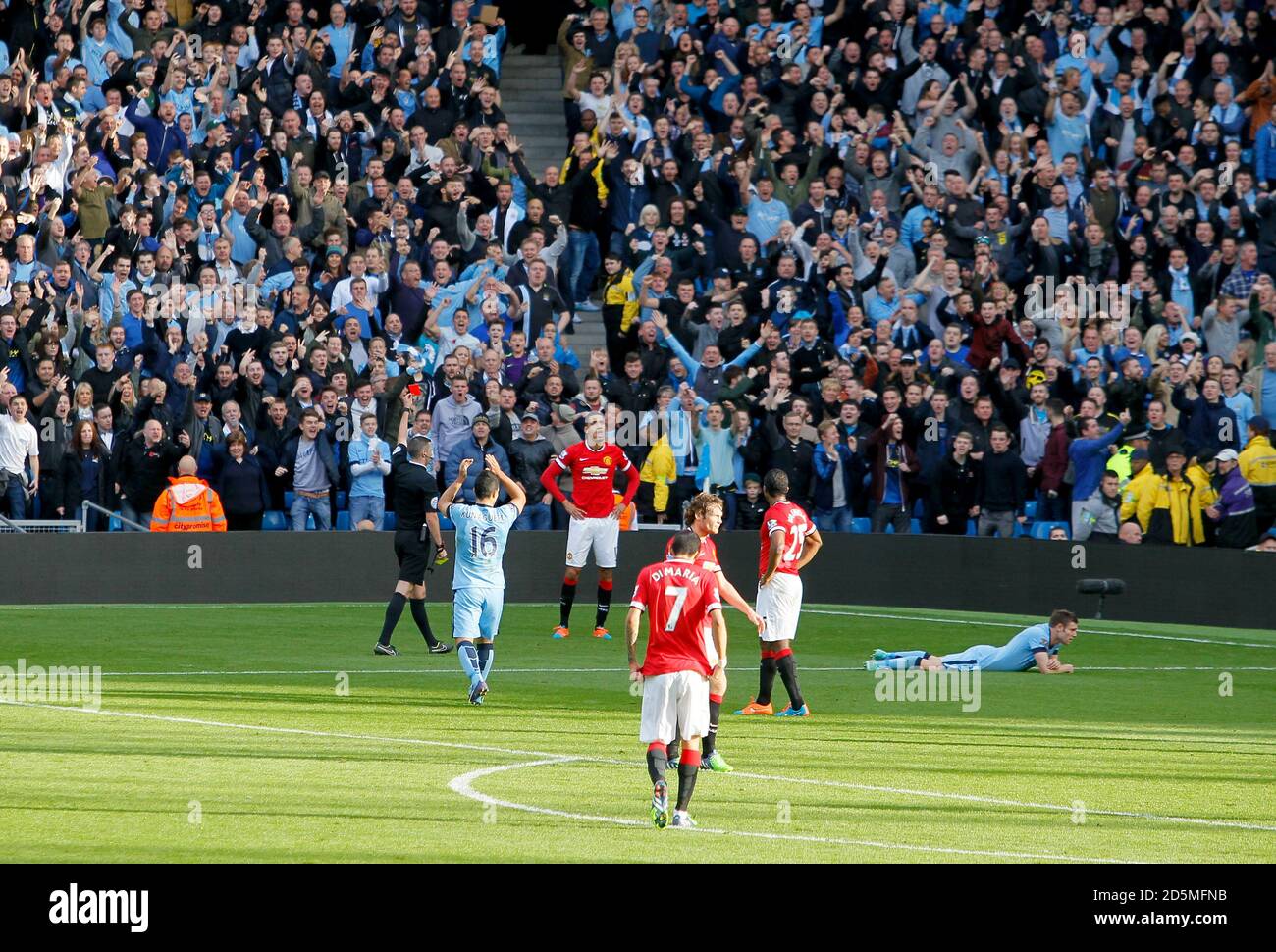 Manchester United's Chris Smalling is shown the red card to the City ...
