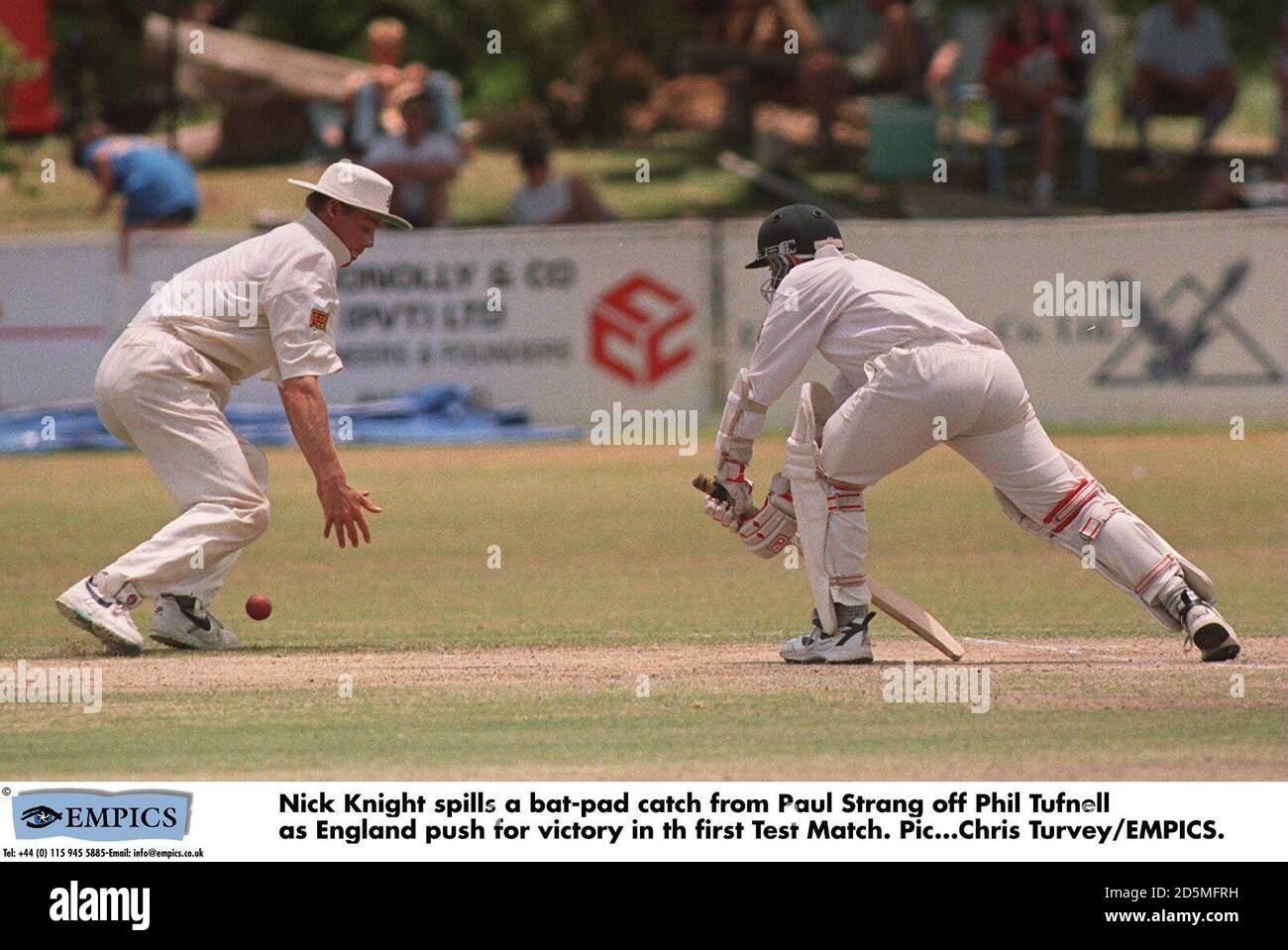 Nick Knight spills a bat-pad catch from Paul Strang off Phil Tufnell ...