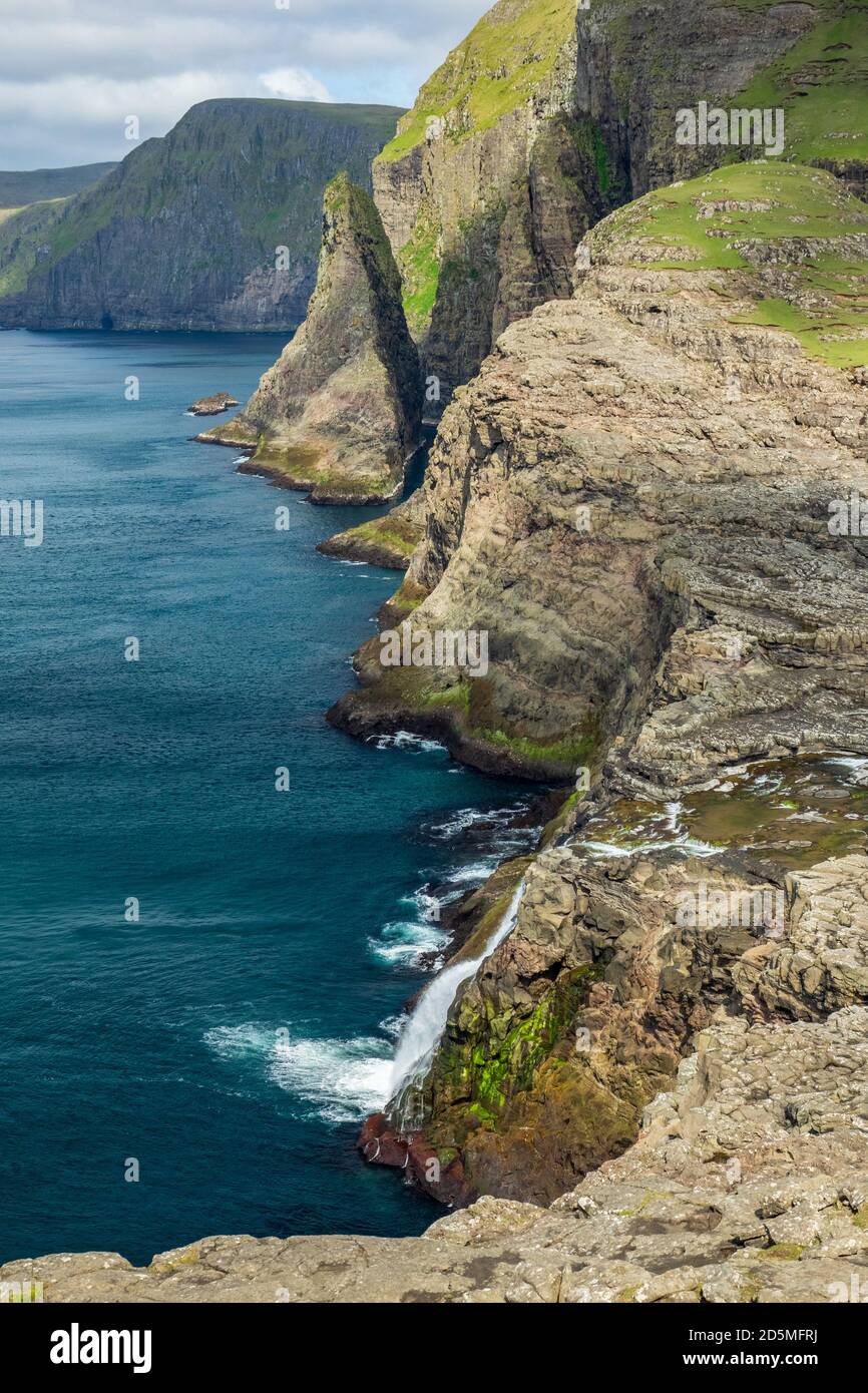 Spectacular steep coastline with high cliffs of faroe islands Stock ...