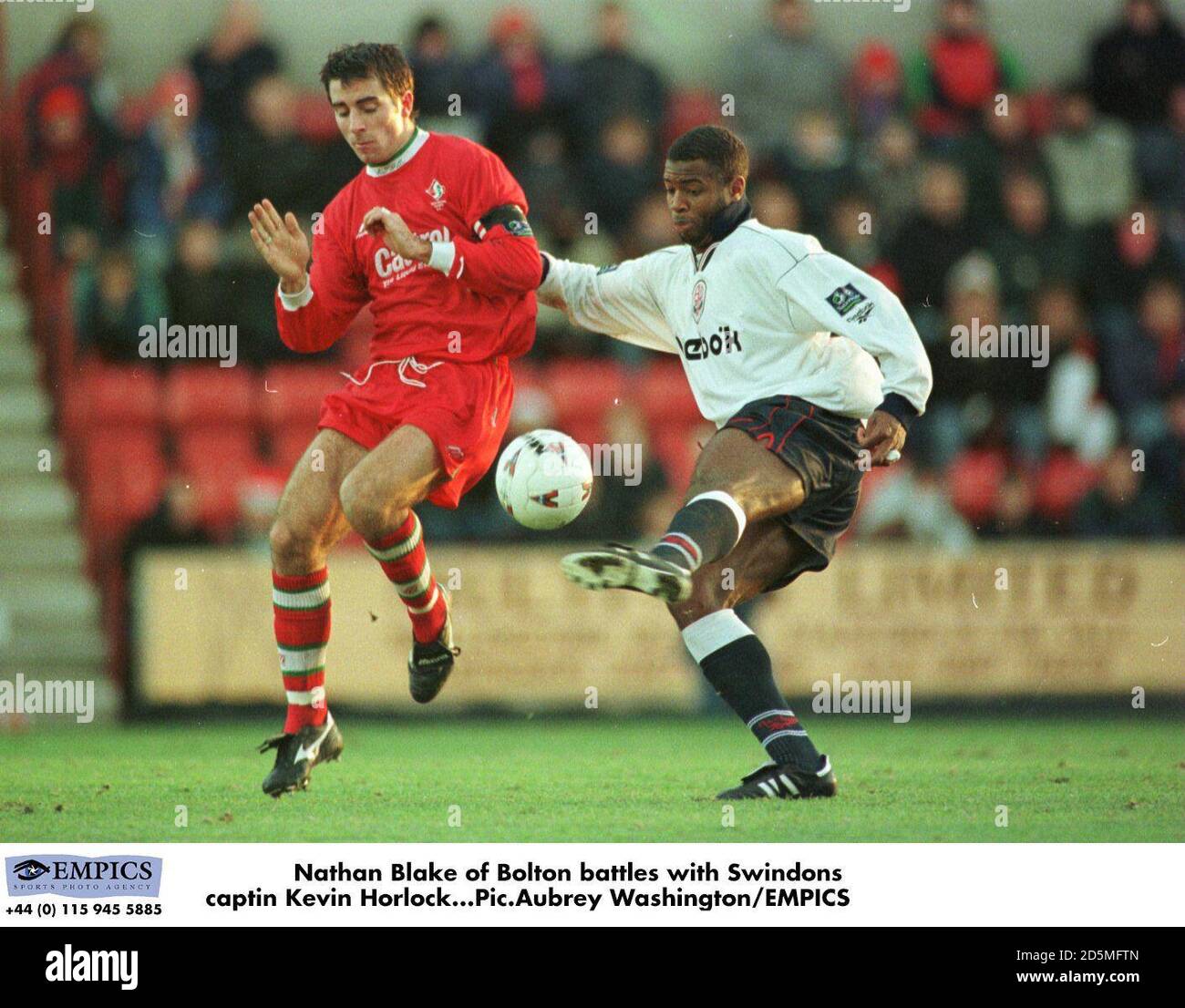 Nathan Blake of Bolton battles with Swindons captin Kevin Horlock Stock ...