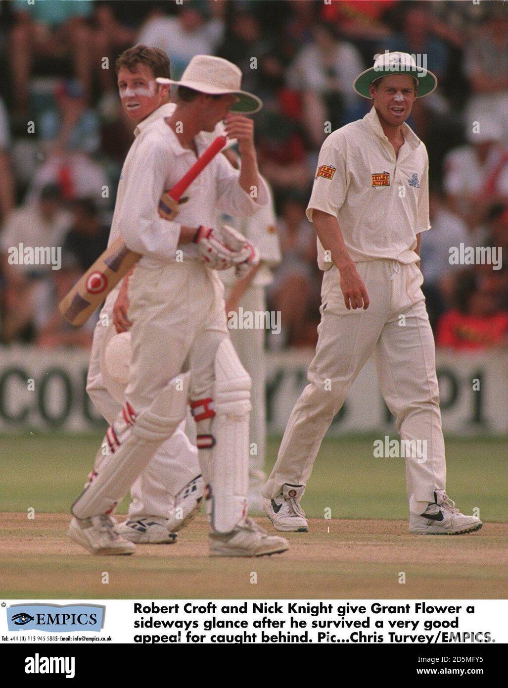 Robert Croft and Nick Knight give Grant Flower a sideways glance after ...