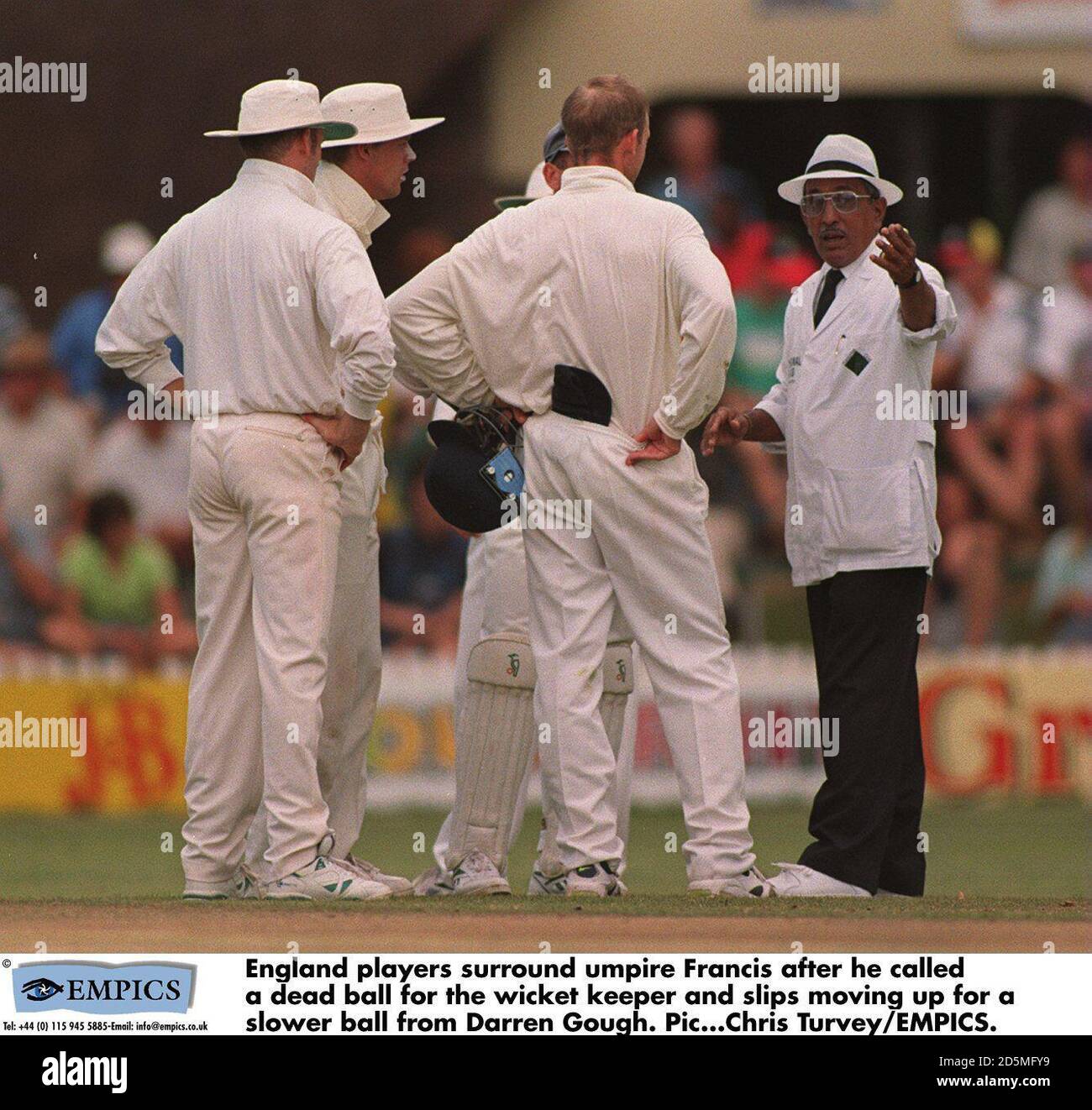 England players surround umpire Francis after he called a dead ball for ...