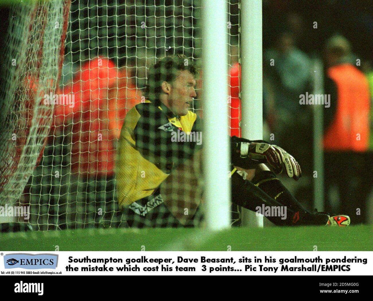 Southampton goalkeeper, Dave Beasant, sits in his goalmouth pondering ...
