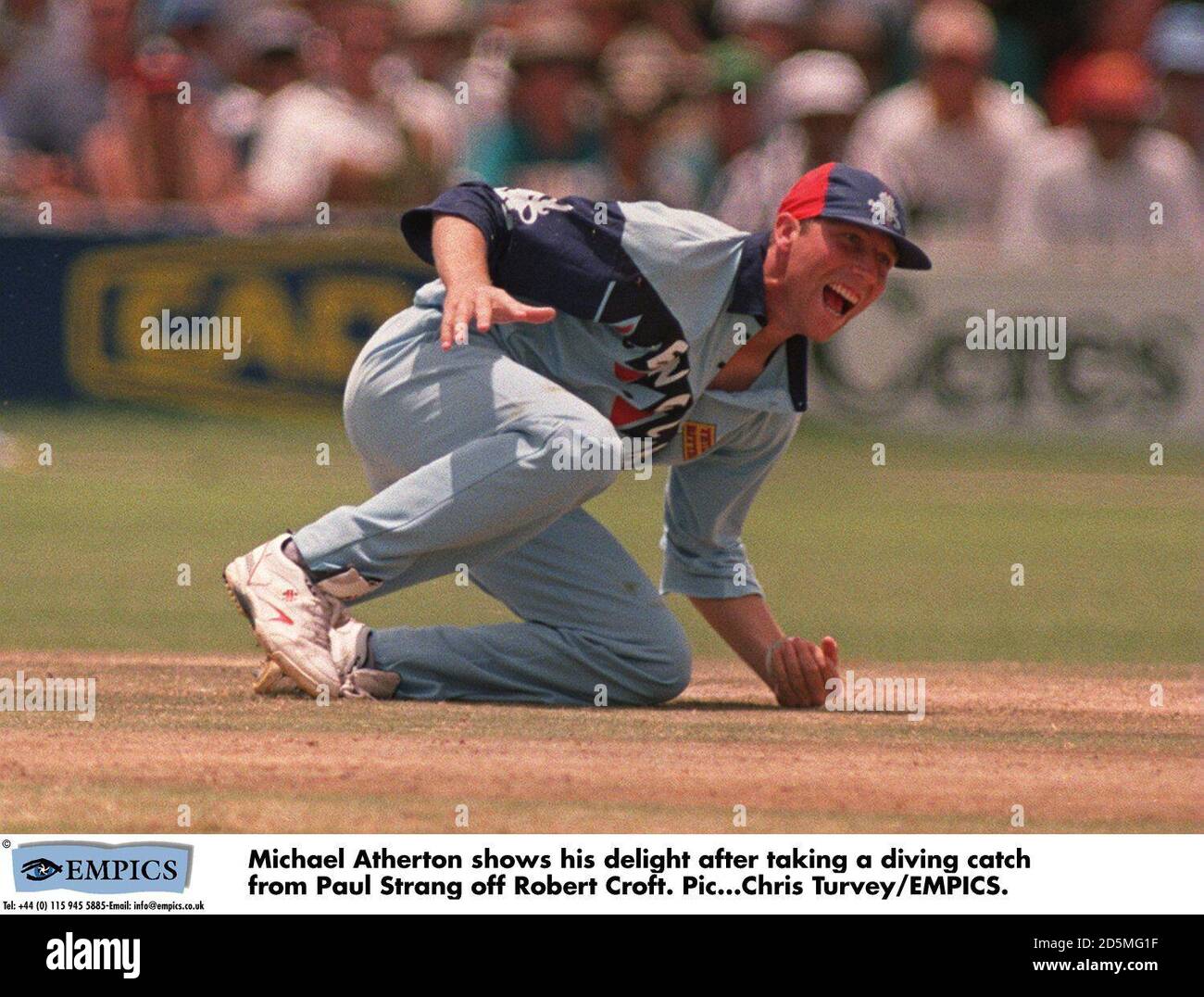 Michael Atherton shows his delight after taking a diving catch from ...