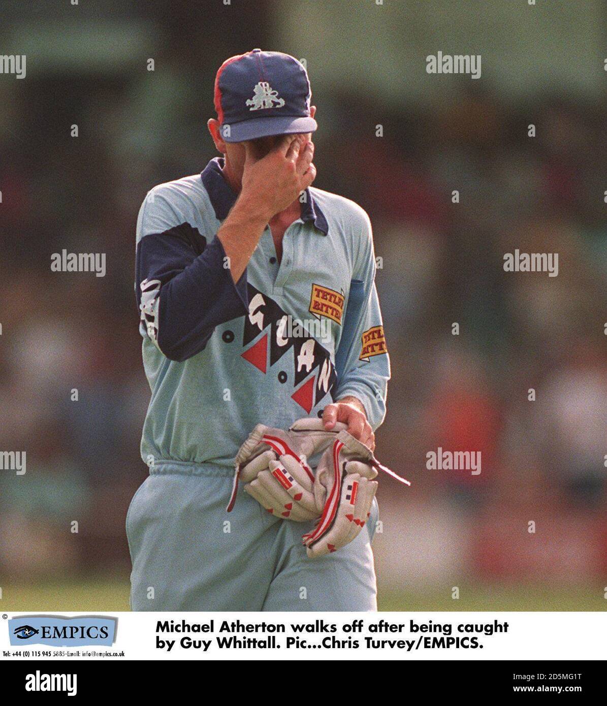 Michael Atherton walks off after being caught by Guy Whittall Stock ...