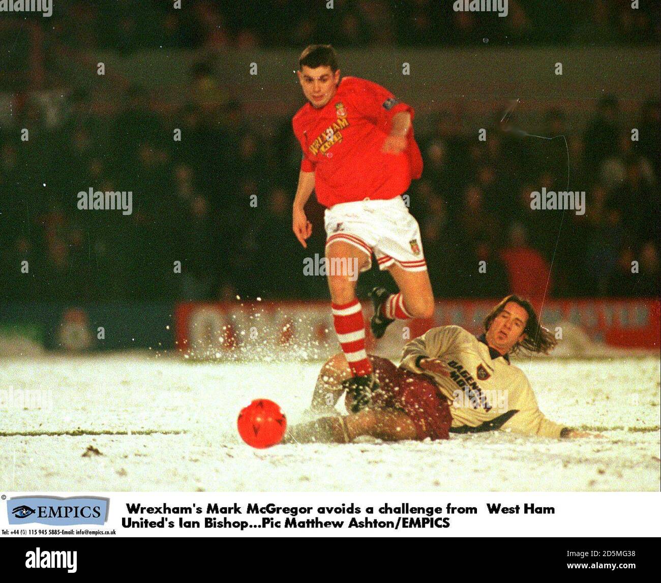 Wrexham's Mark McGregor avoids a challenge from West Ham United's Ian ...