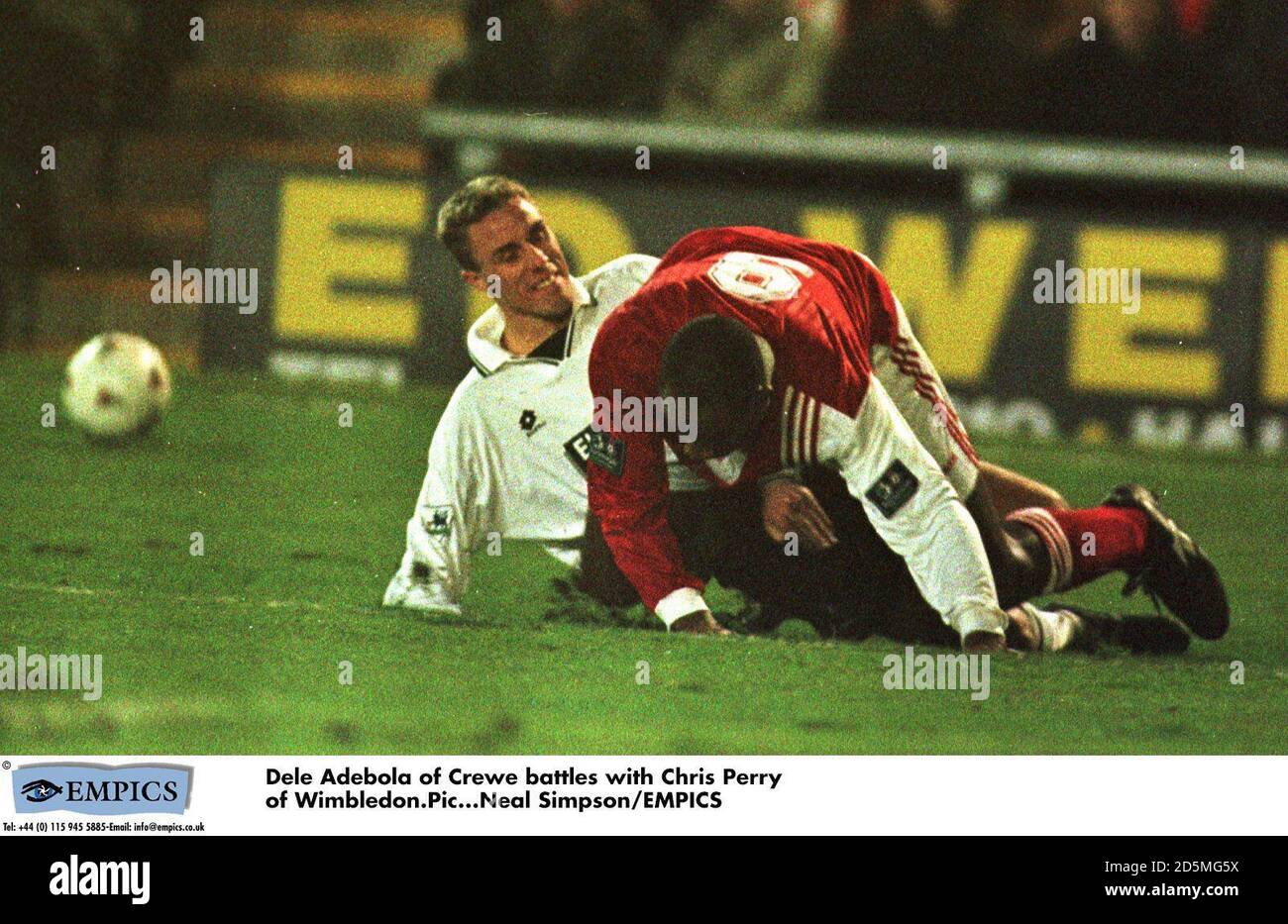 Dele Adebola of Crewe battles with Chris Perry of Wimbledon Stock Photo ...