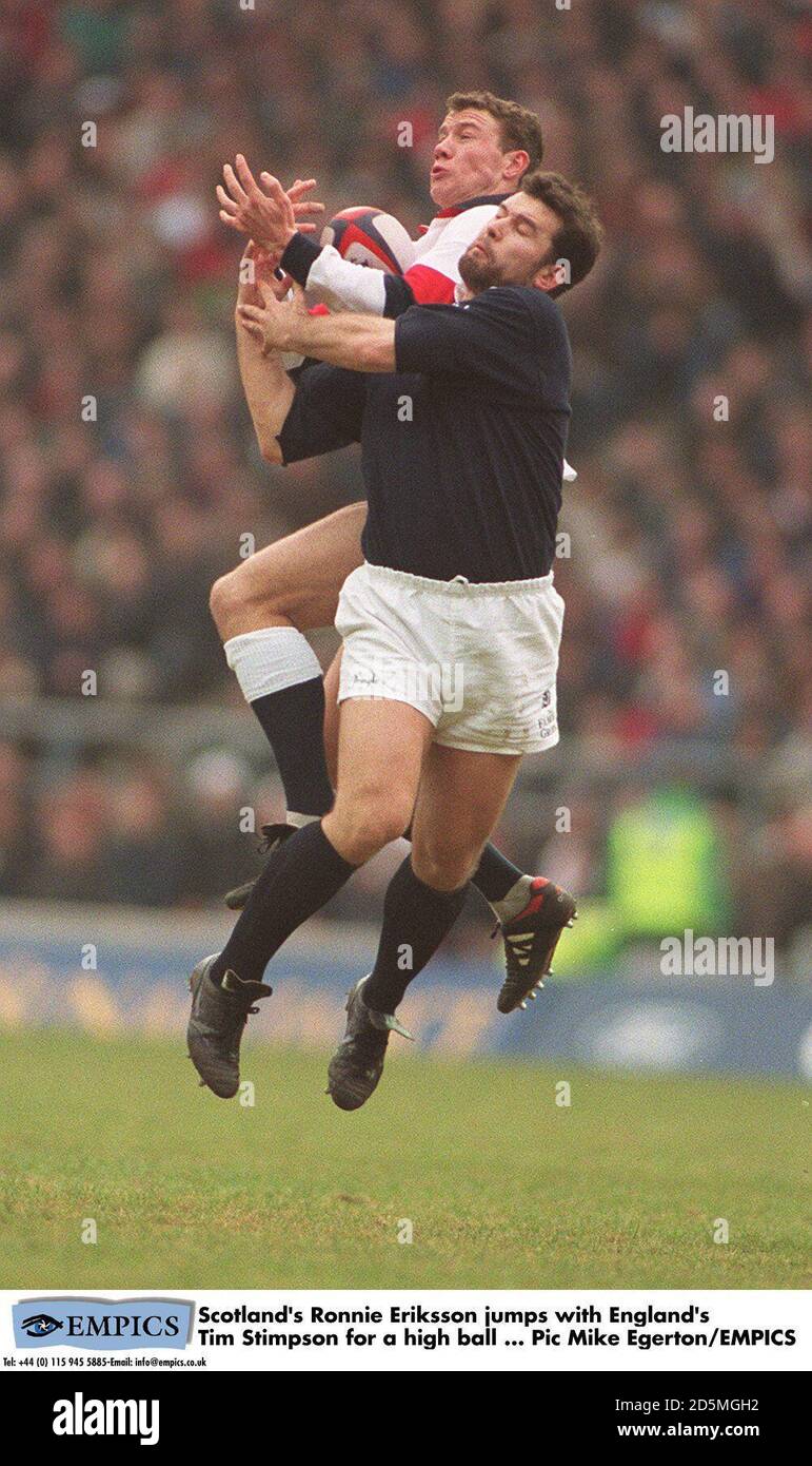 Scotland's Ronnie Eriksson jumps with England's Tim Stimpson for a high ...