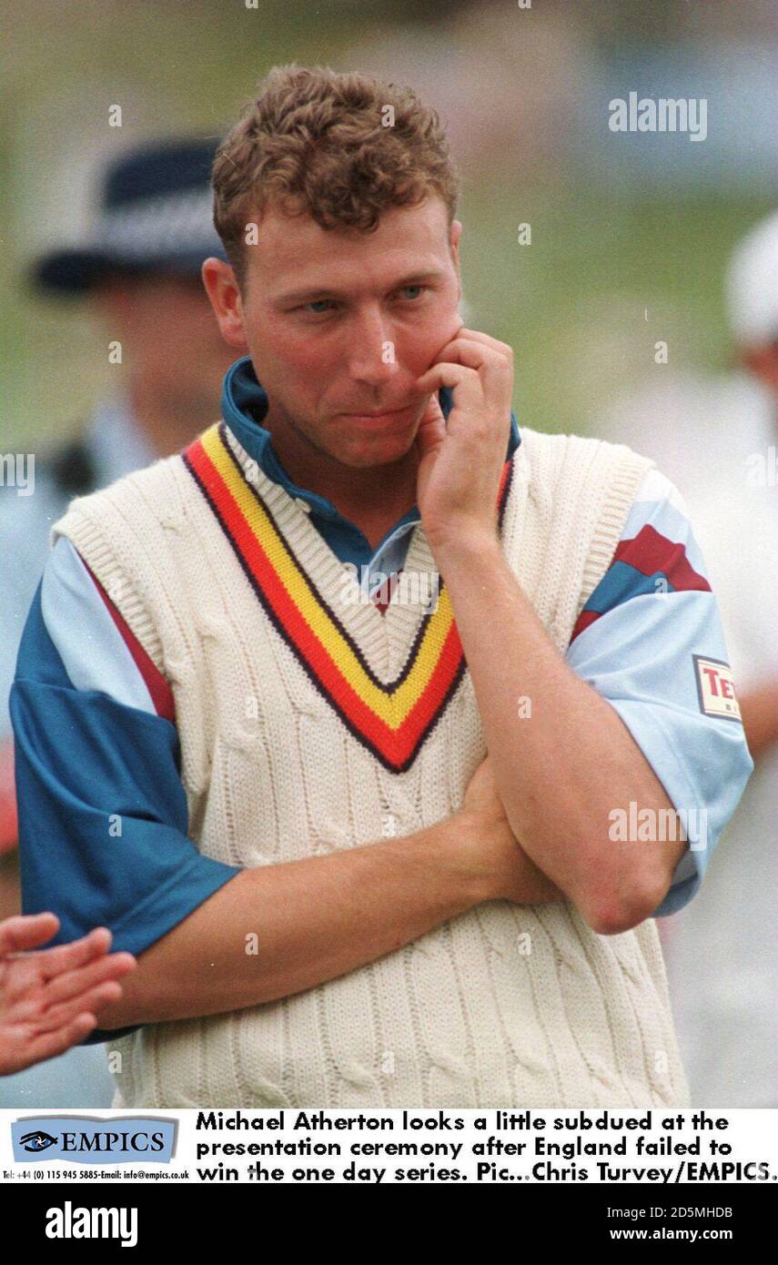 Michael Atherton looks a little subdued at the presentation ceremony ...