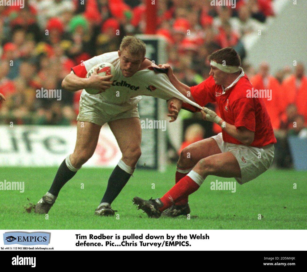 Tim Rodber is pulled down by the Welsh defence Stock Photo - Alamy