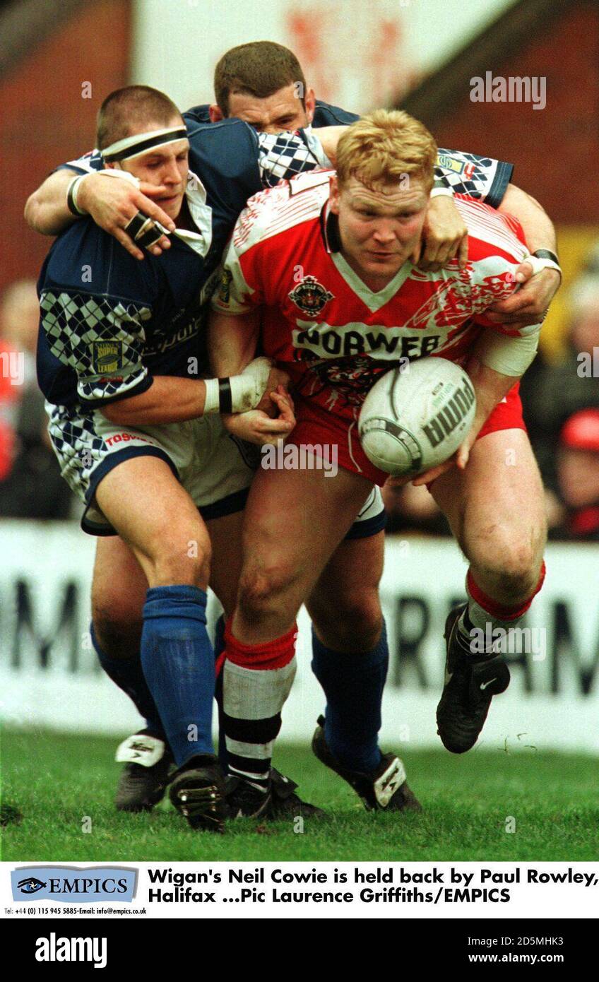 Wigan's Neil Cowie is held back by Paul Rowley, Halifax Stock Photo - Alamy