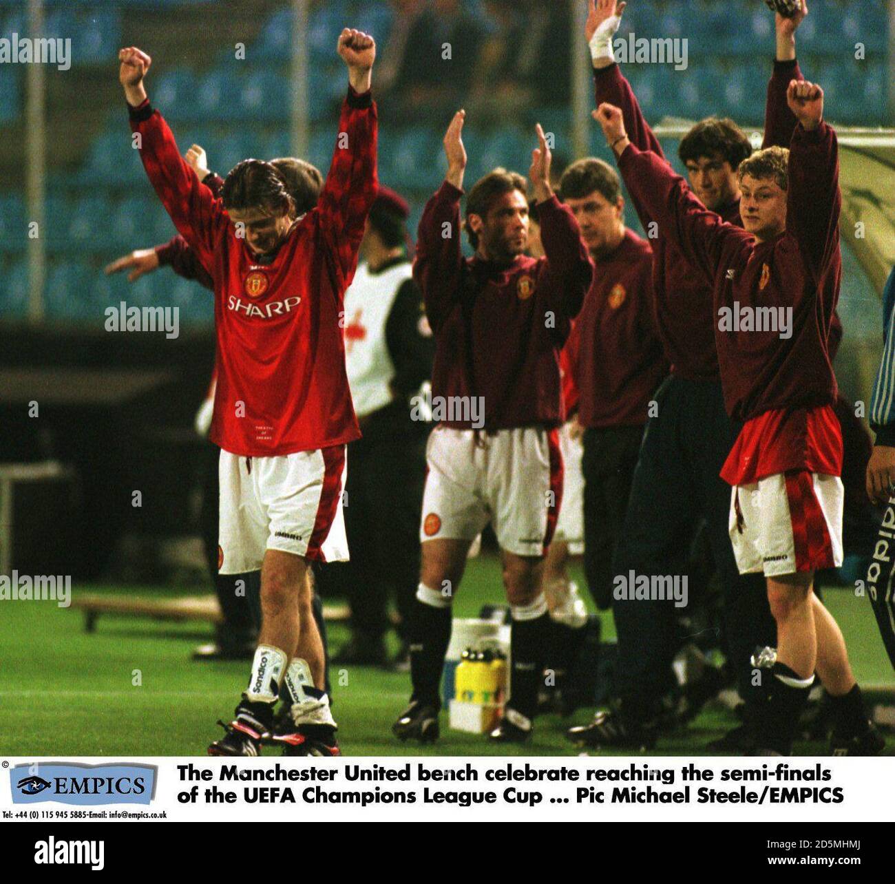 The Manchester United bench celebrate reaching the semi-finals of the ...