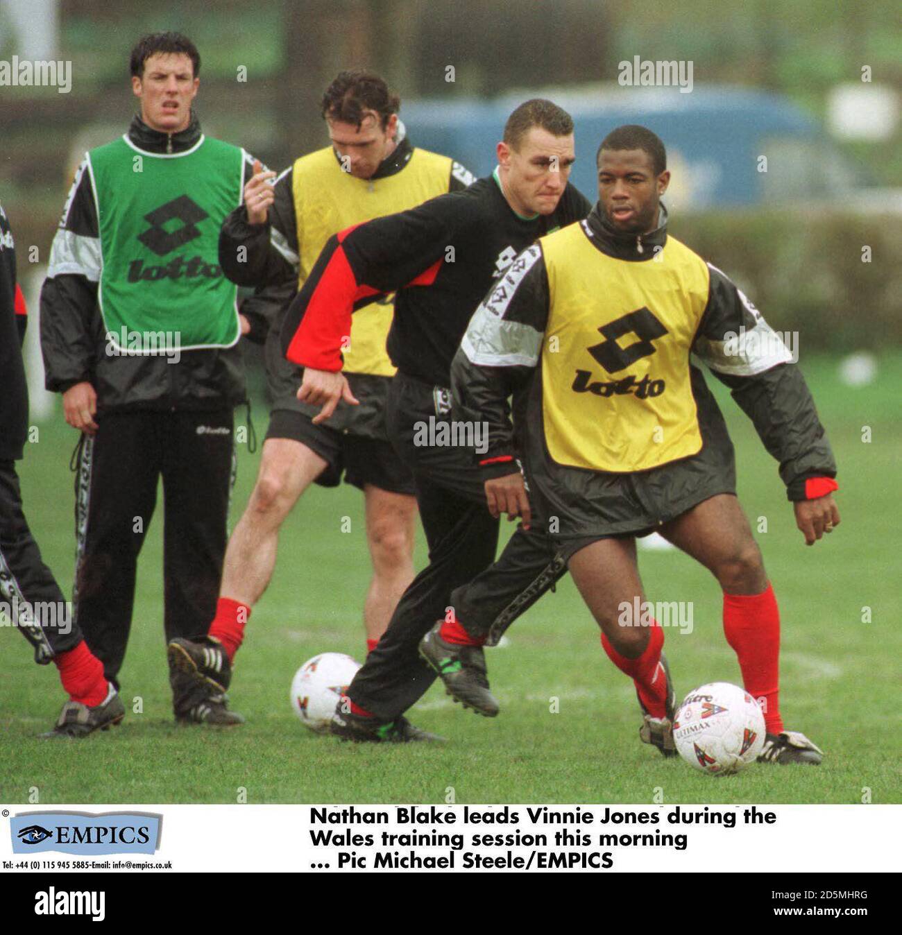 Nathan Blake leads Vinnie Jones during the Wales training session this ...