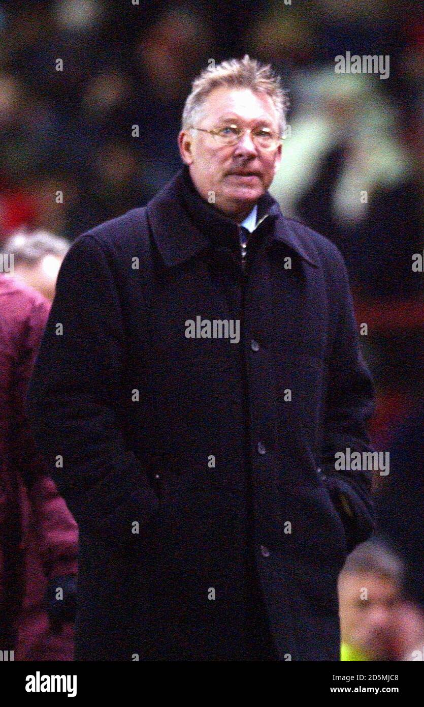 Manchester United's Manager Alex Ferguson walks off after seeing his ...
