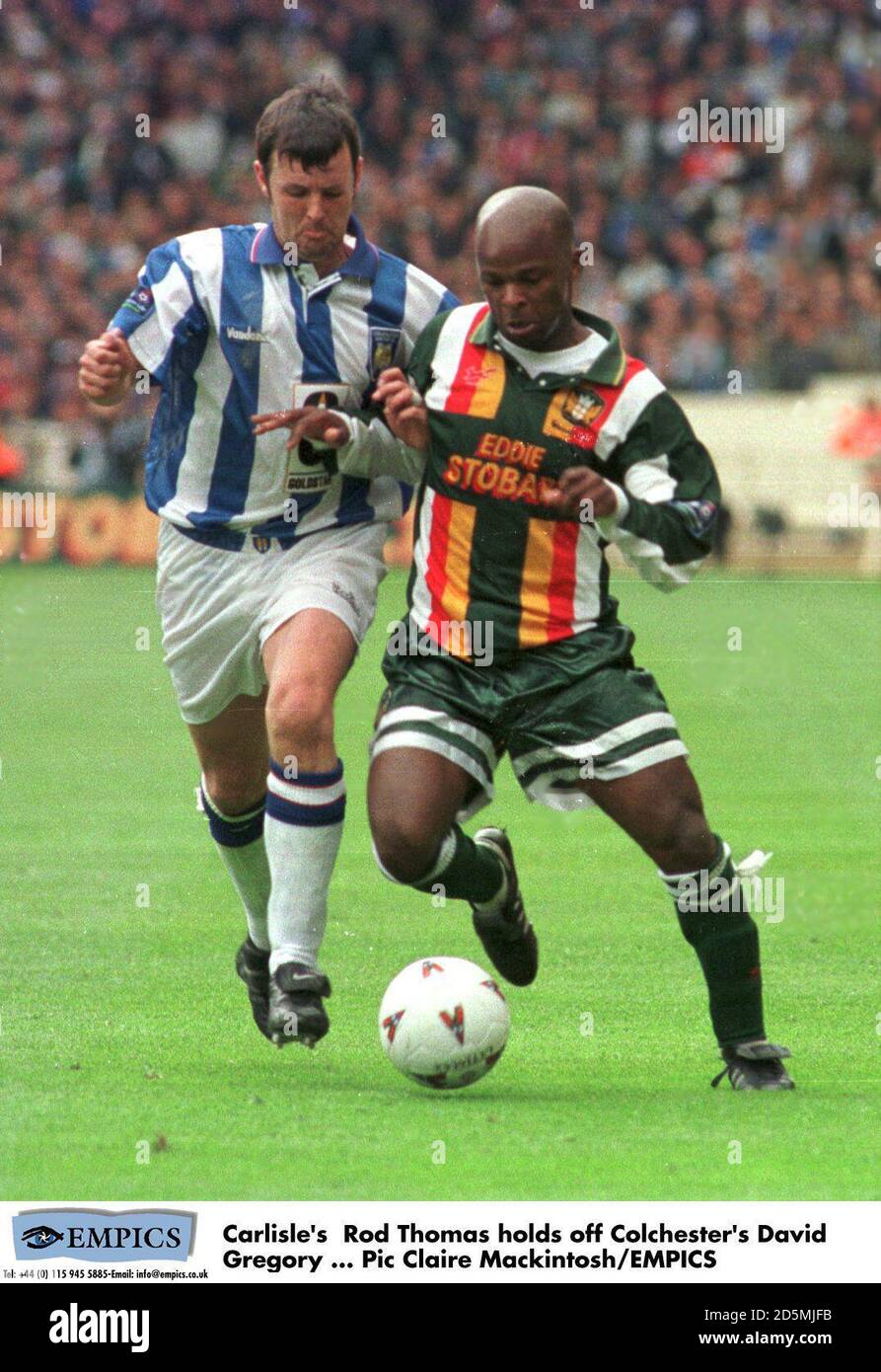 Carlisle's Rod Thomas holds off Colchester's David Gregory Stock Photo ...