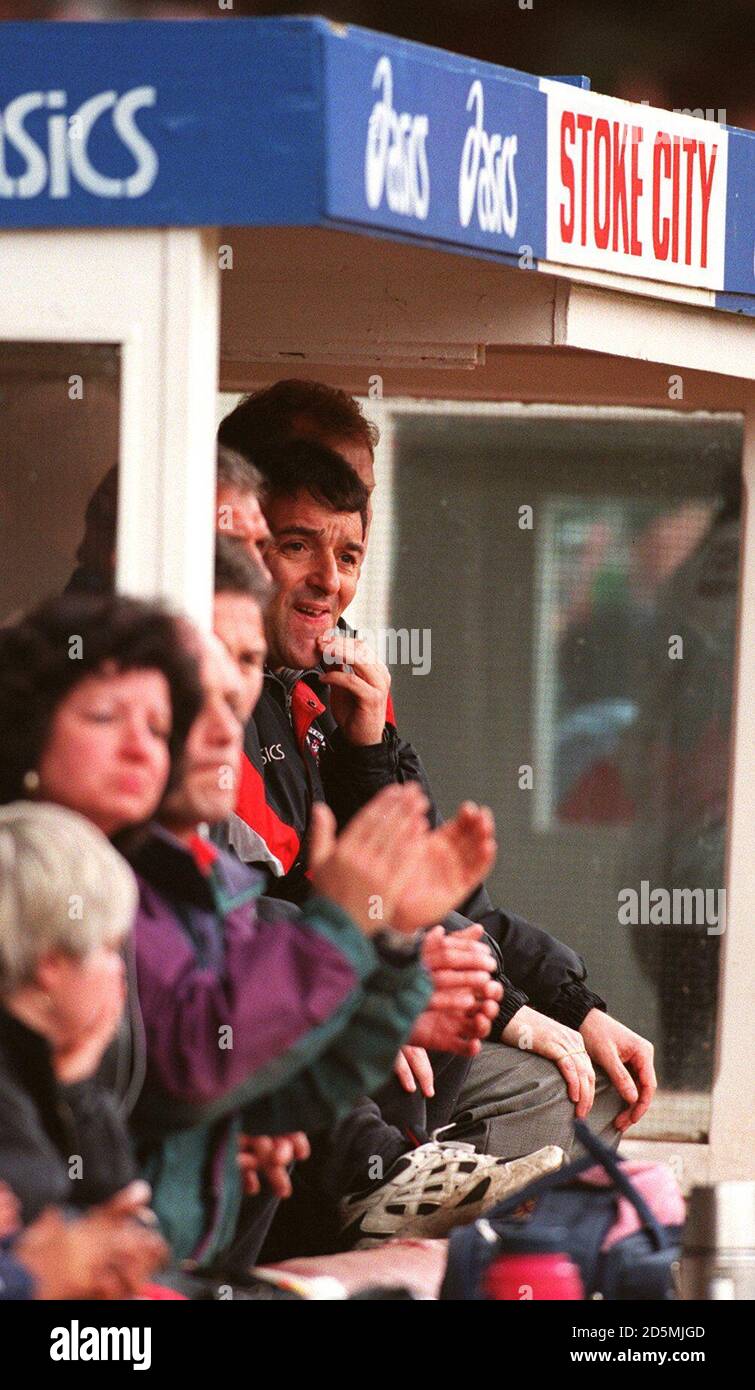Stoke City manager Lou Macari watches the game from the bench Stock ...
