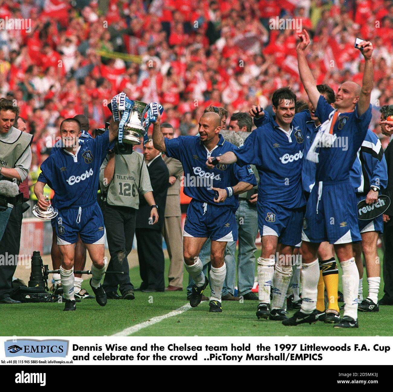 Dennis Wise and the Chelsea team hold the 1997 Littlewoods F.A. Cup and ...