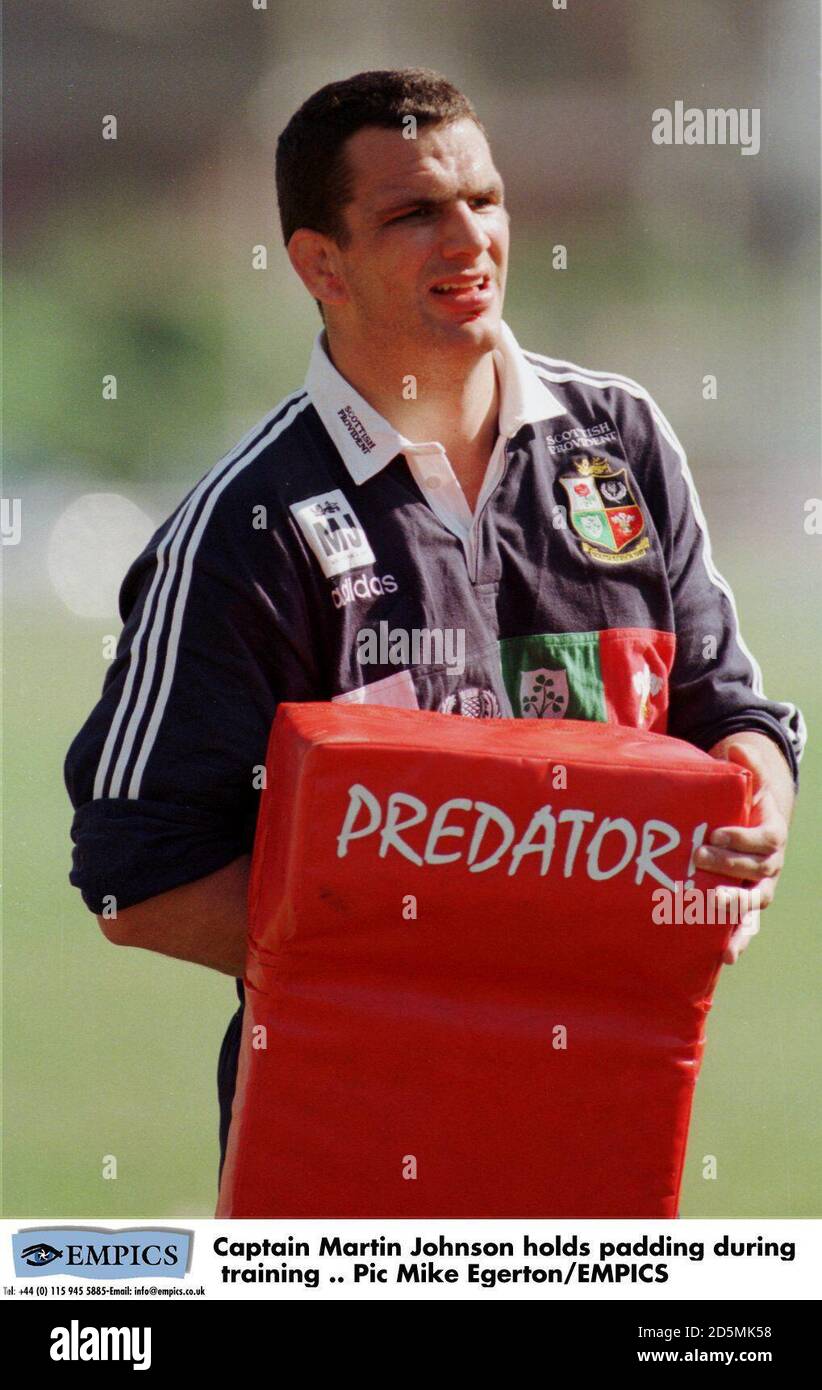 Captain Martin Johnson holds padding during training Stock Photo - Alamy