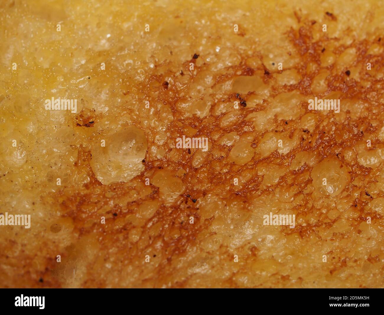 The texture of wheat bread toasted in butter. Macro mode Stock Photo ...