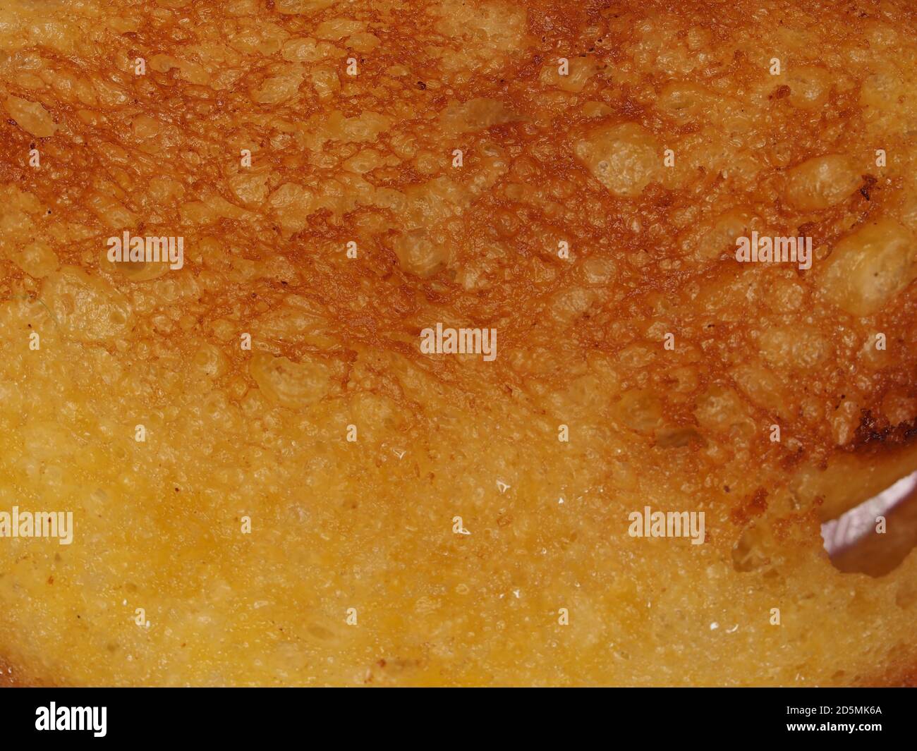 The texture of wheat bread toasted in butter. Macro mode Stock Photo ...