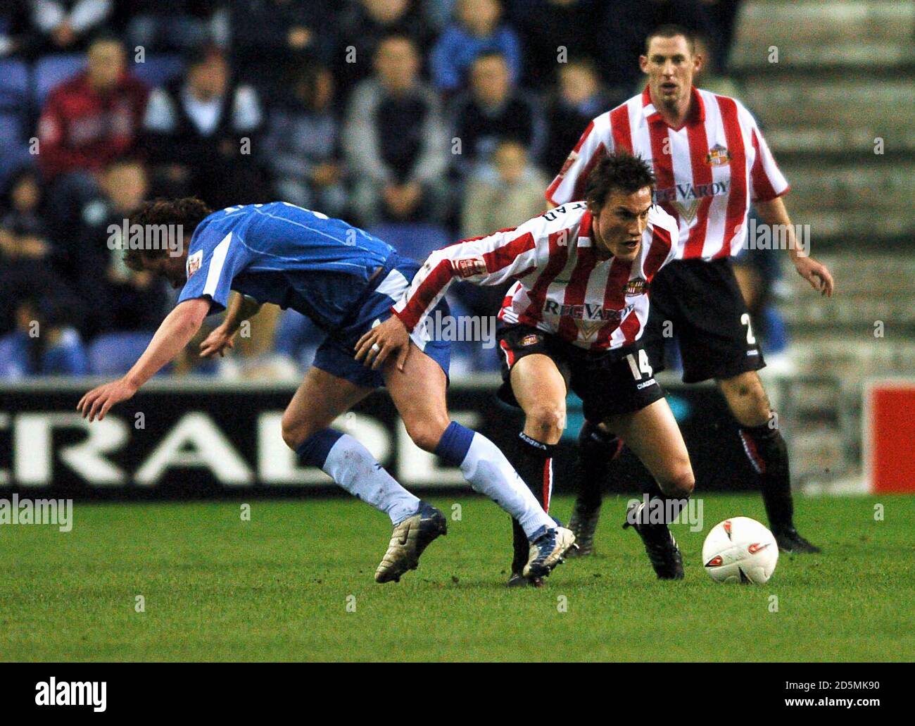Wigan Athletic's Alan Mahon is brushed aside by Sunderland's Dean ...