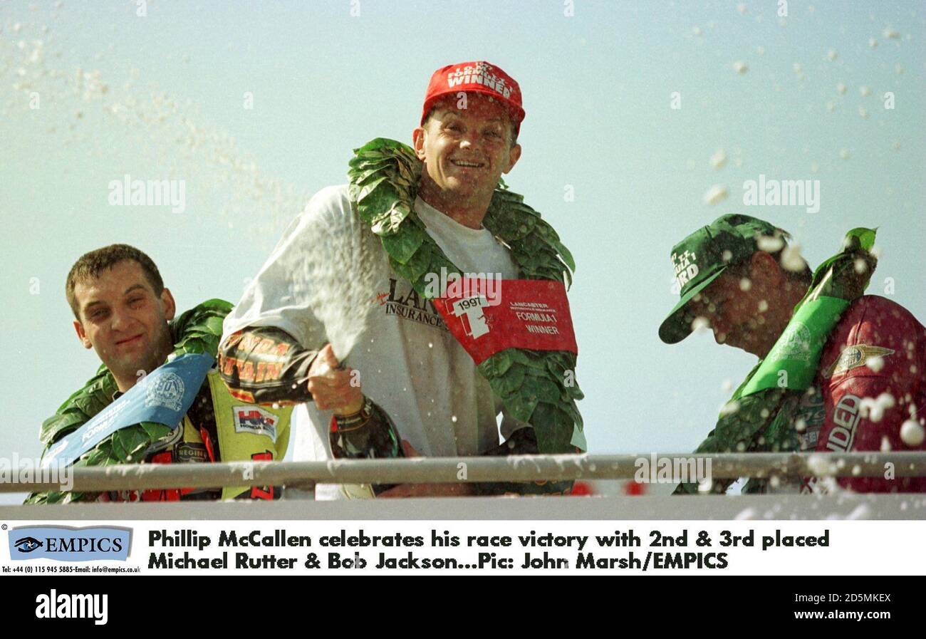 Phillip McCallen celebrates his race victory with 2nd & 3rd placed ...