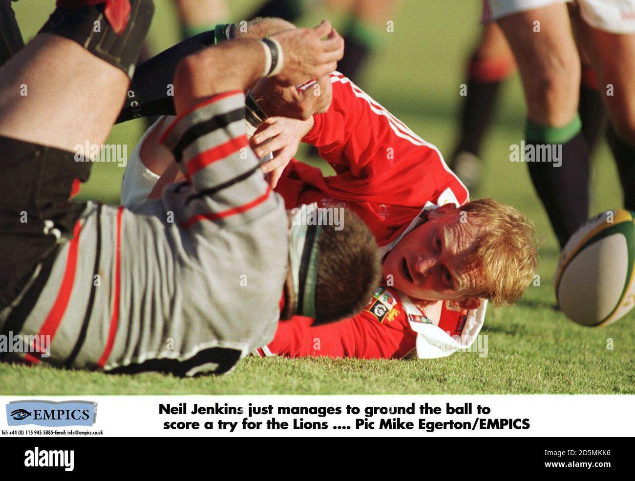 Neil Jenkins just manages to ground the ball to score a try for the ...