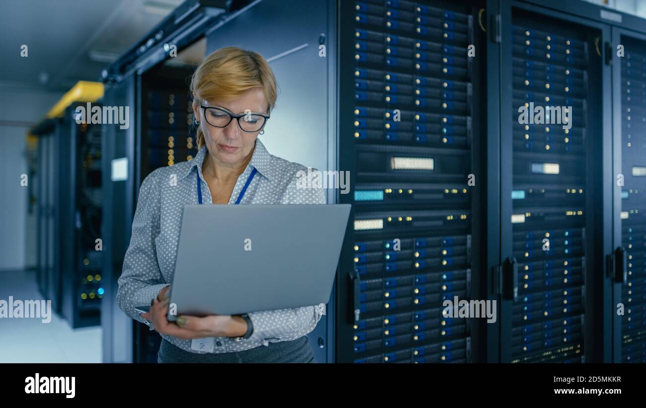 Portrait Shot In Data Center: Female IT Technician Running Maintenance ...