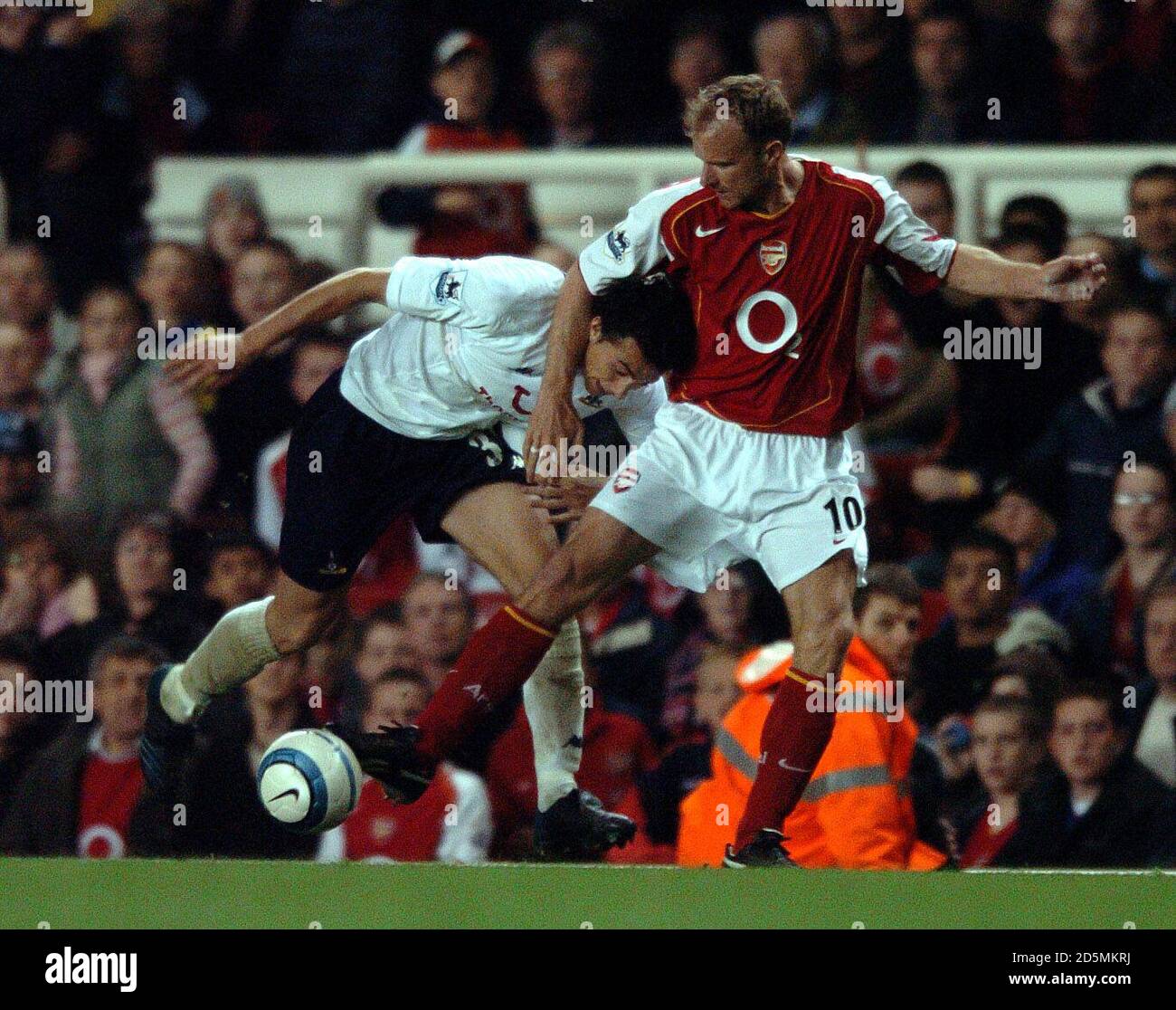 Arsenal's Dennis Bergkamp grapples with Tottenham Hotspur's Stephen ...