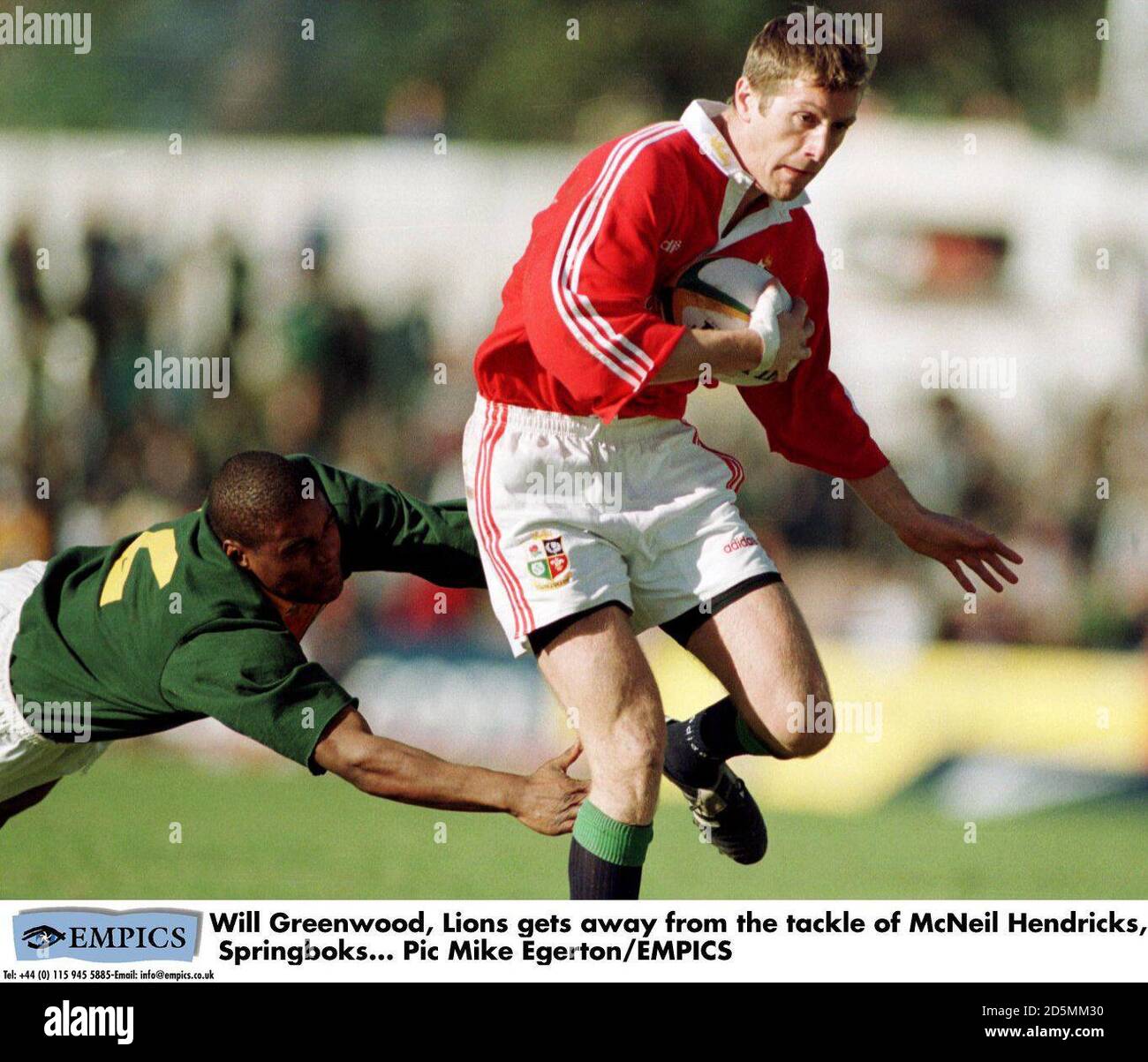Will Greenwood, Lions gets away from the tackle of McNeil Hendricks ...