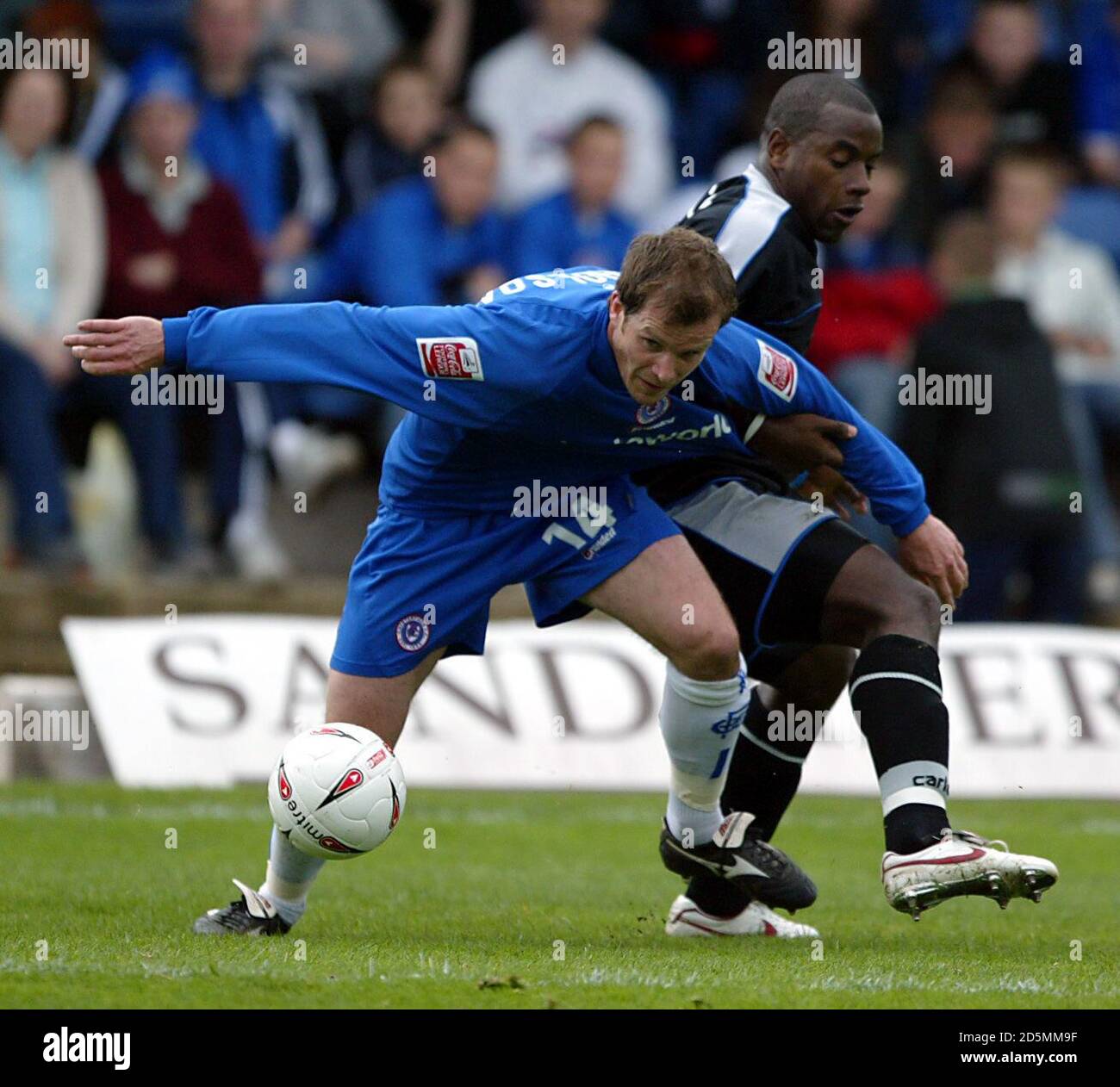 Chesterfield's Shane Nicholson and Oldham Athletic's Delroy Facey ...
