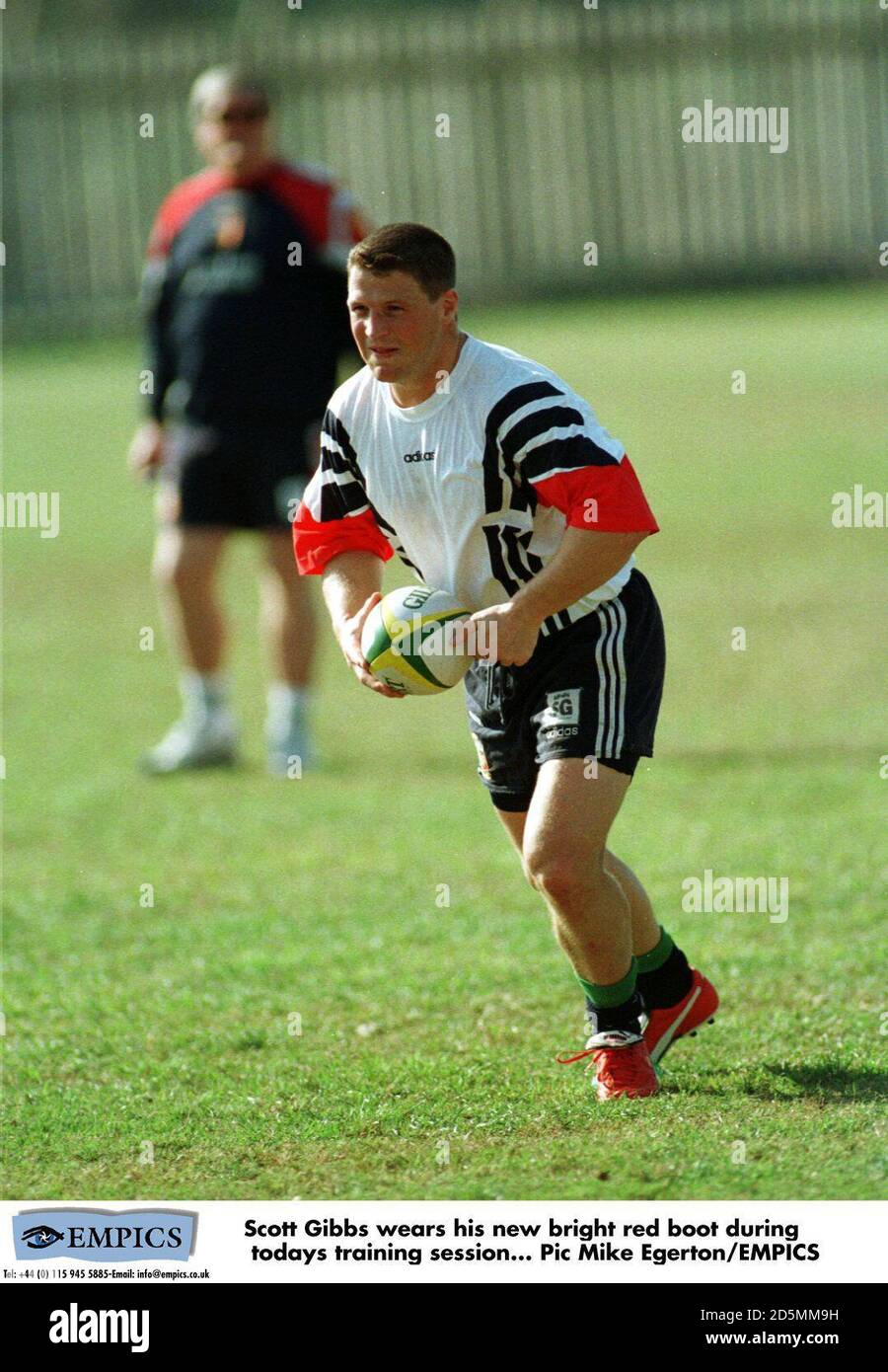 Scott Gibbs wears his new bright red boots during todays training ...