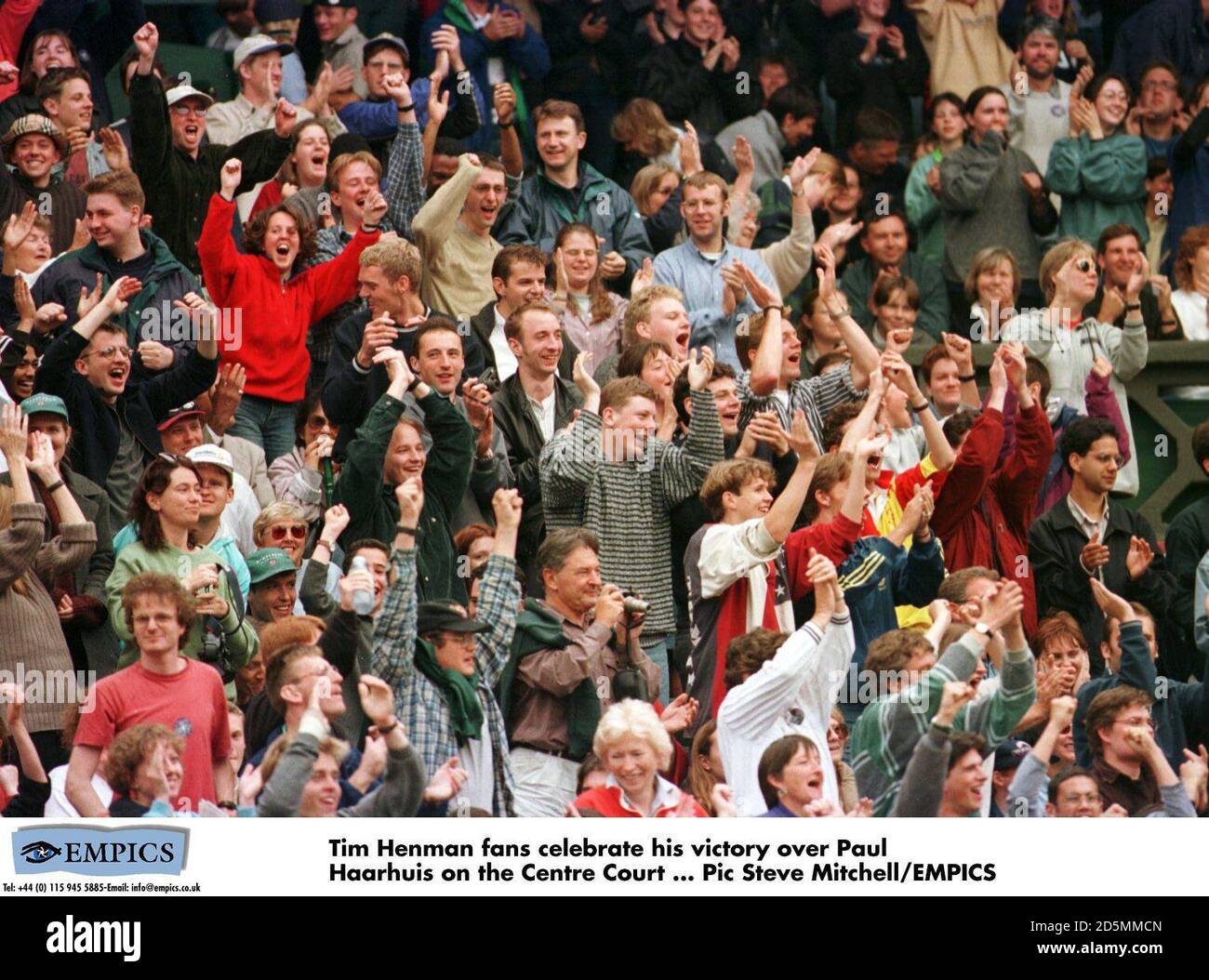 Tim Henman fans celebrate his victory over Paul Haarhuis on the Centre ...