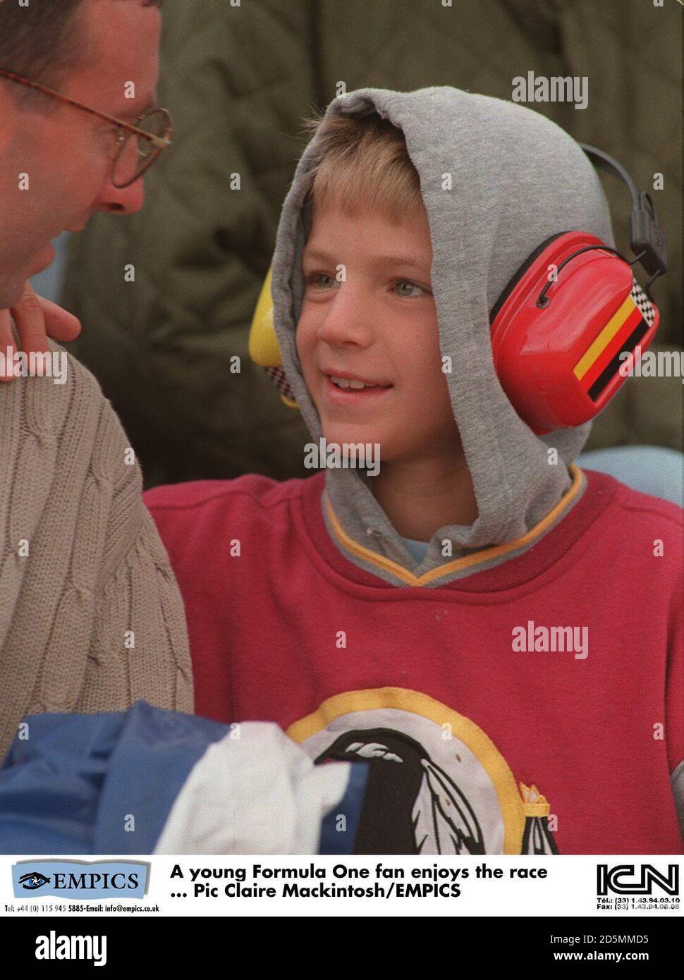 A young Formula One fan enjoys the race Stock Photo - Alamy