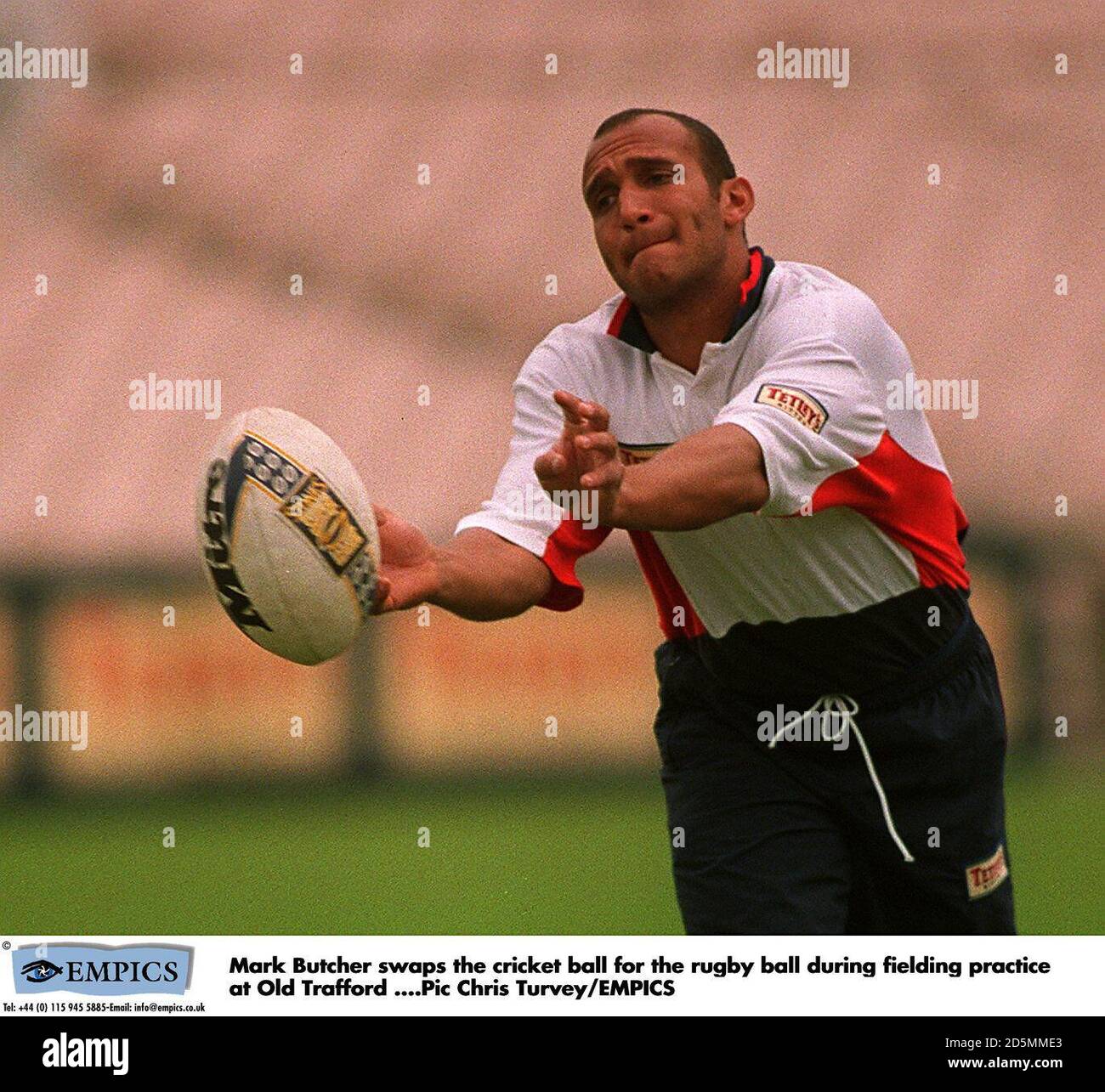 Mark Butcher swaps the cricket ball for the rugby ball during fielding ...
