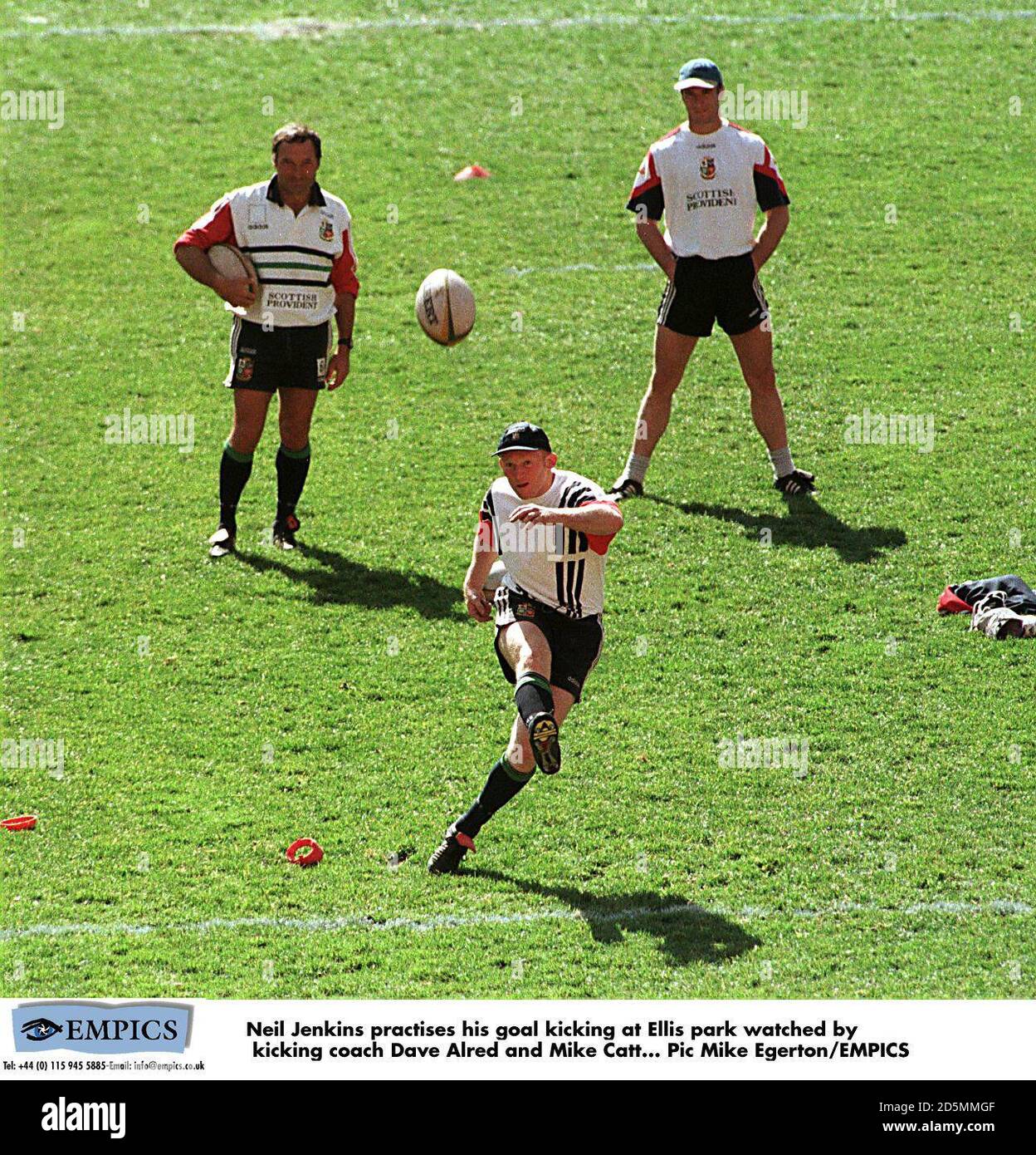 Neil Jenkins practises his goal kicking at Ellis park watched by ...